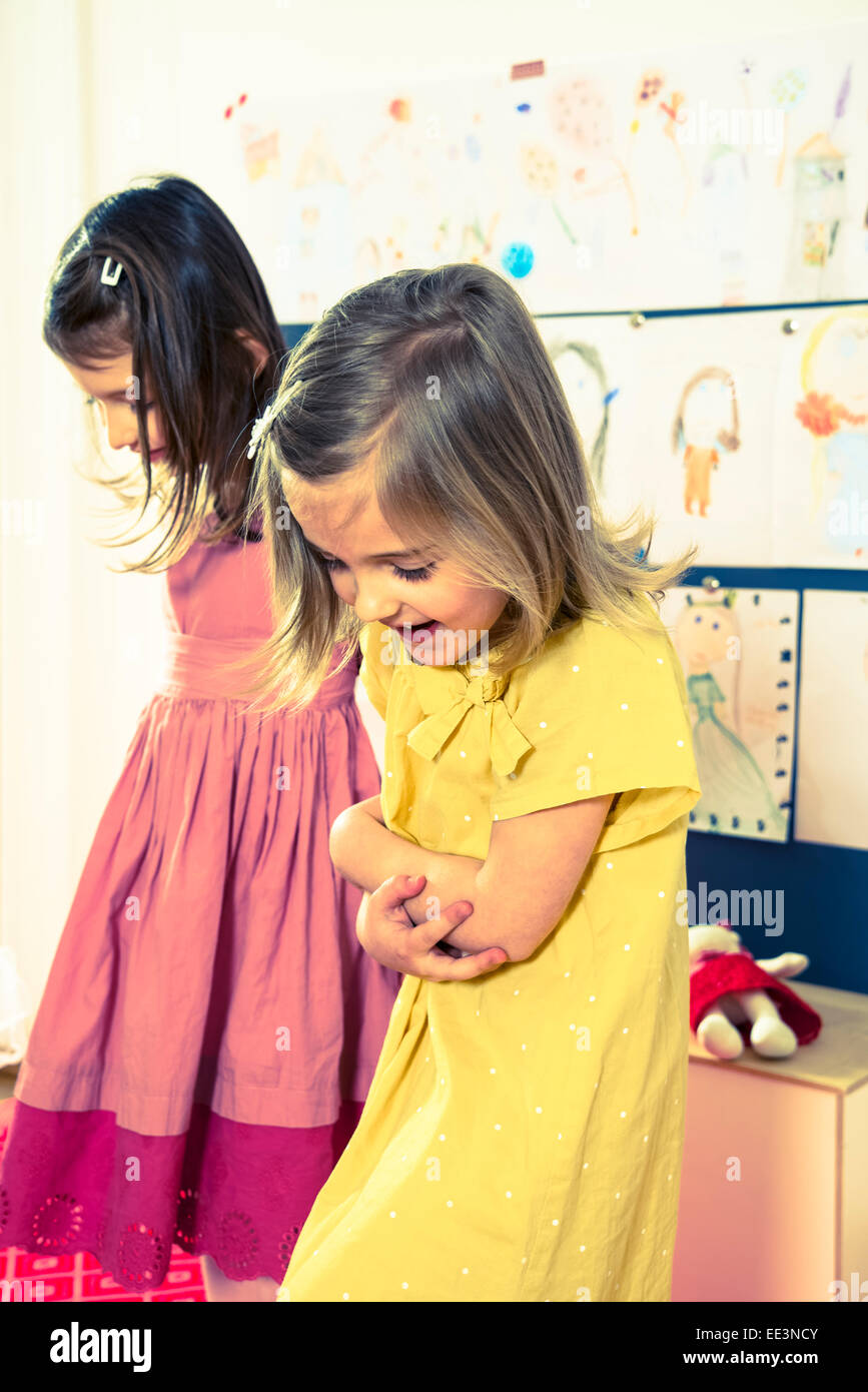 Two girls playing in nursery Stock Photo - Alamy