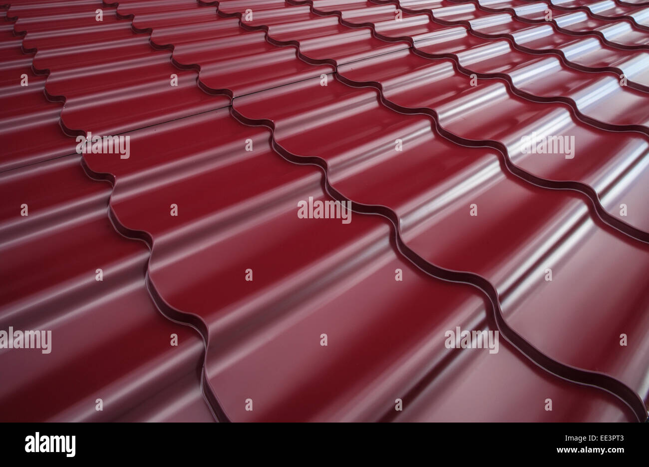Steel roof painted in red color. Red roof Stock Photo - Alamy