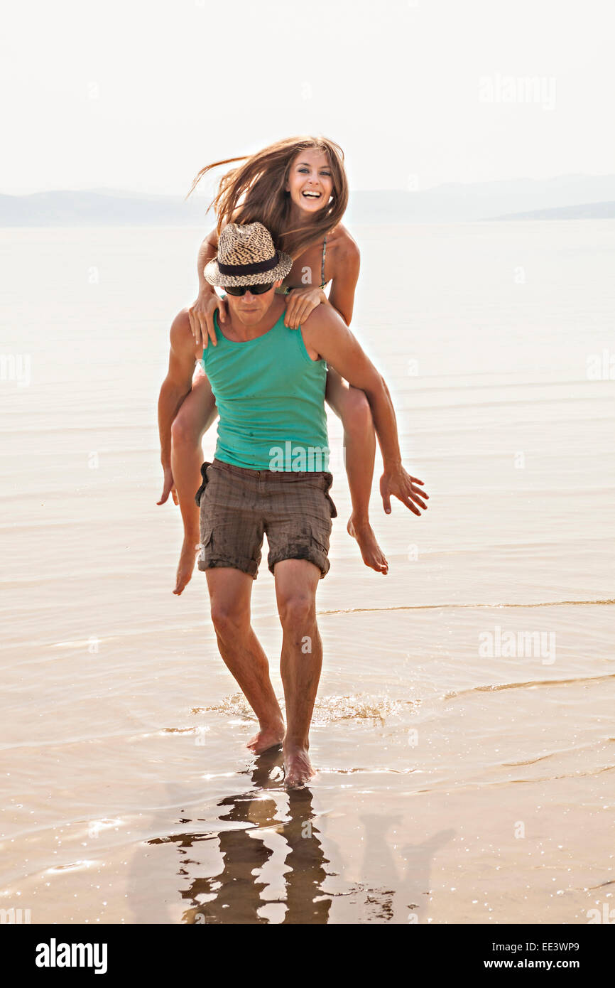 Croatia, Young couple on beach fooling around Stock Photo - Alamy