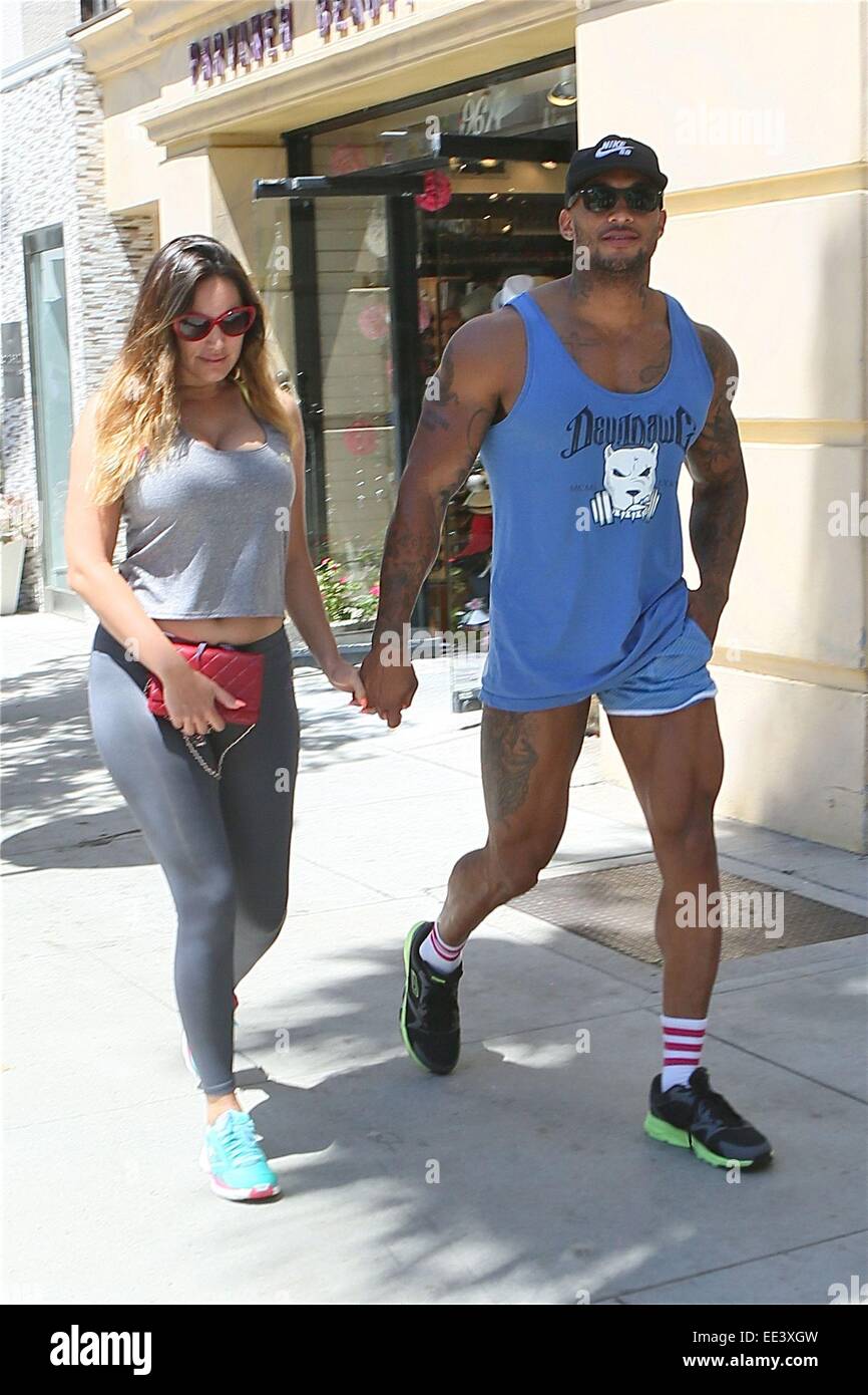 Kelly Brook and David McIntosh hold hands while out and about in ...