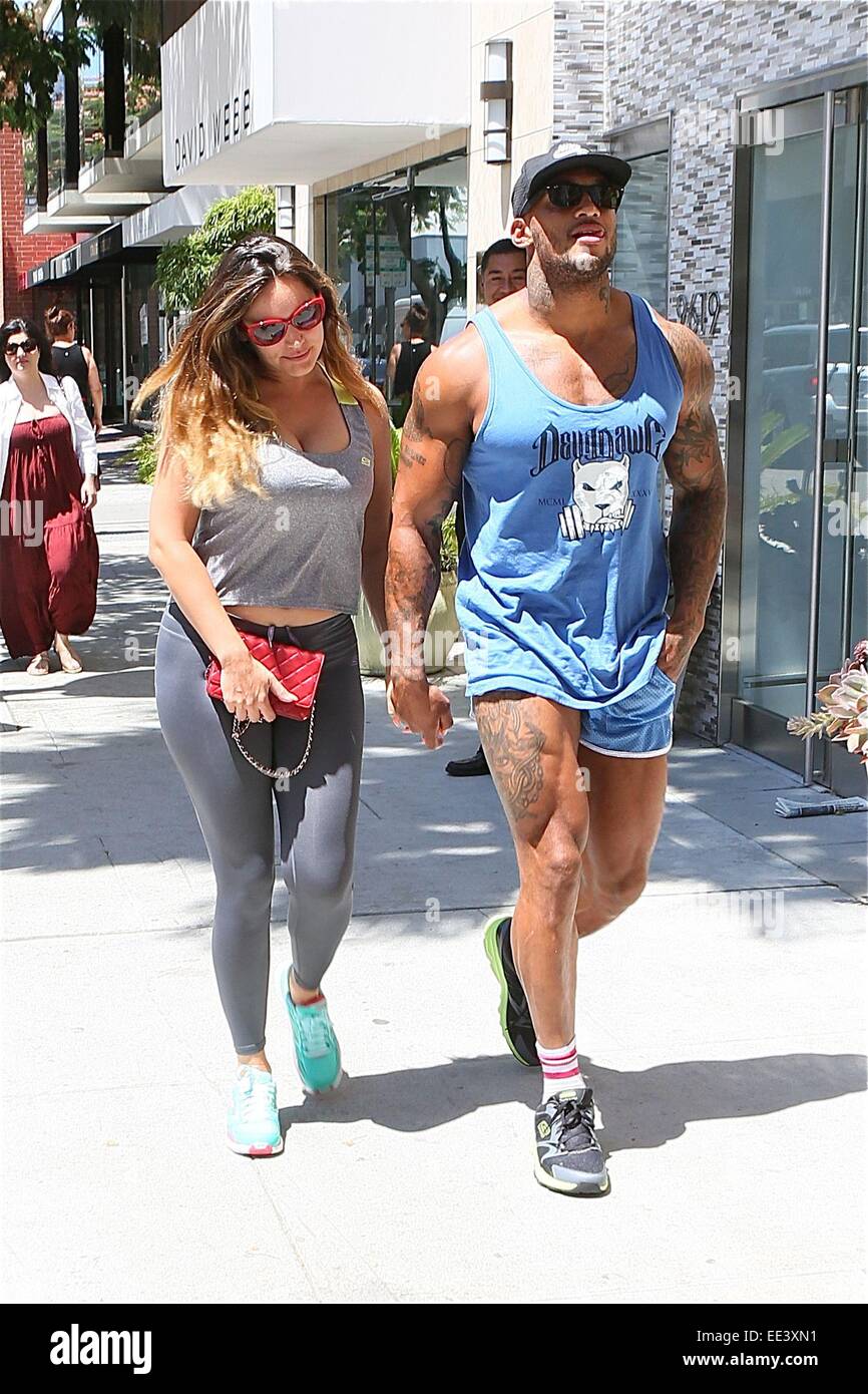 Kelly Brook and David McIntosh hold hands while out and about in ...