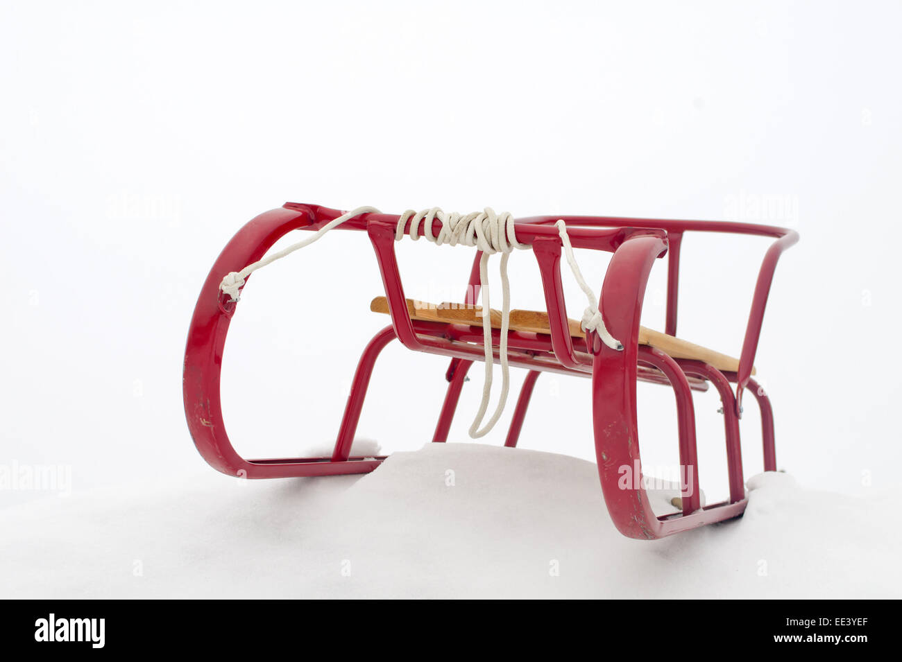 Red sledge in the snow hi-res stock photography and images - Alamy