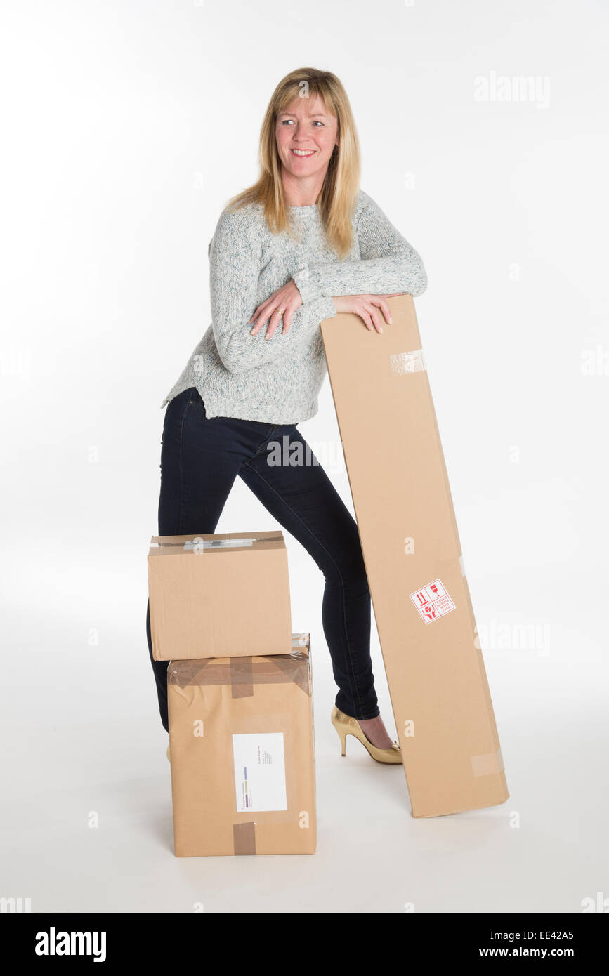 Person carrying cardboard boxes hi-res stock photography and images - Alamy