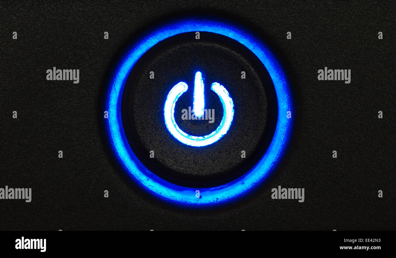 Blue glowing power button on a black pattern background Stock Photo - Alamy