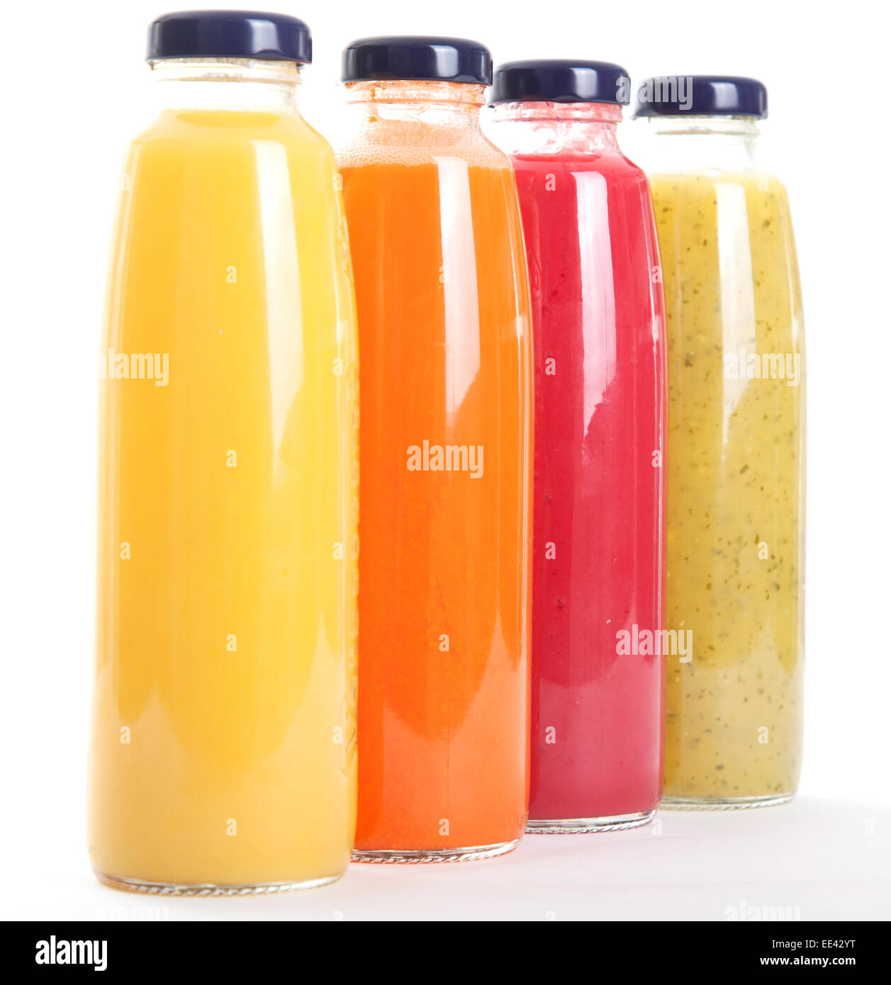 Bottles of fruit juice isolated on white background Stock Photo - Alamy