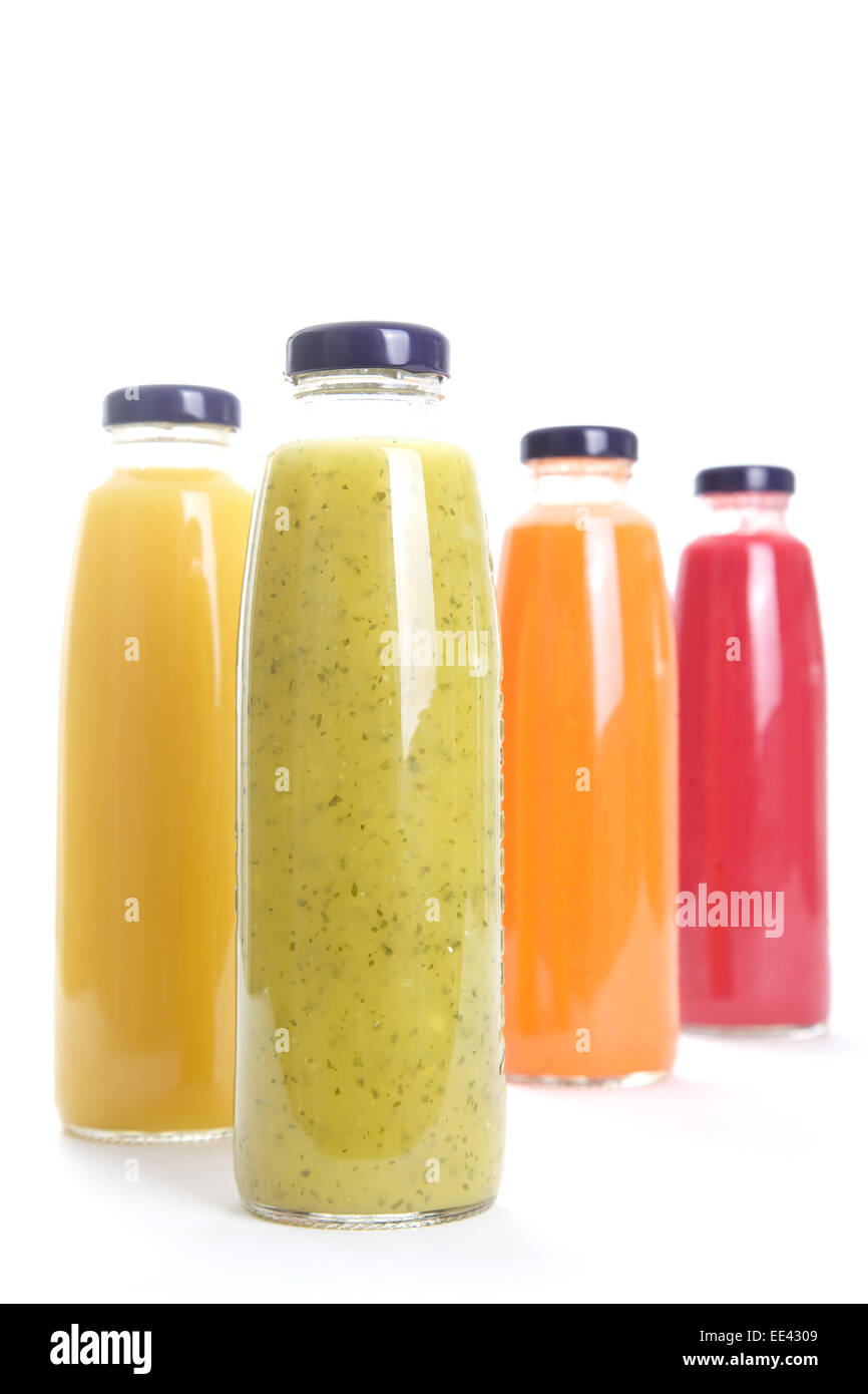 Bottles of fruit juice isolated on white background Stock Photo - Alamy