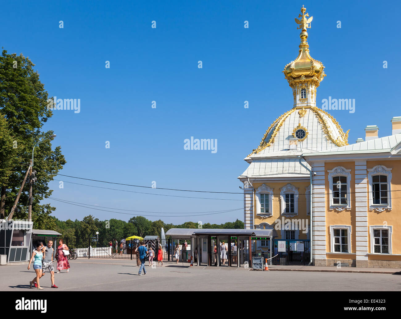People walking in front a Chapel of the main buildings at Peterhof ...