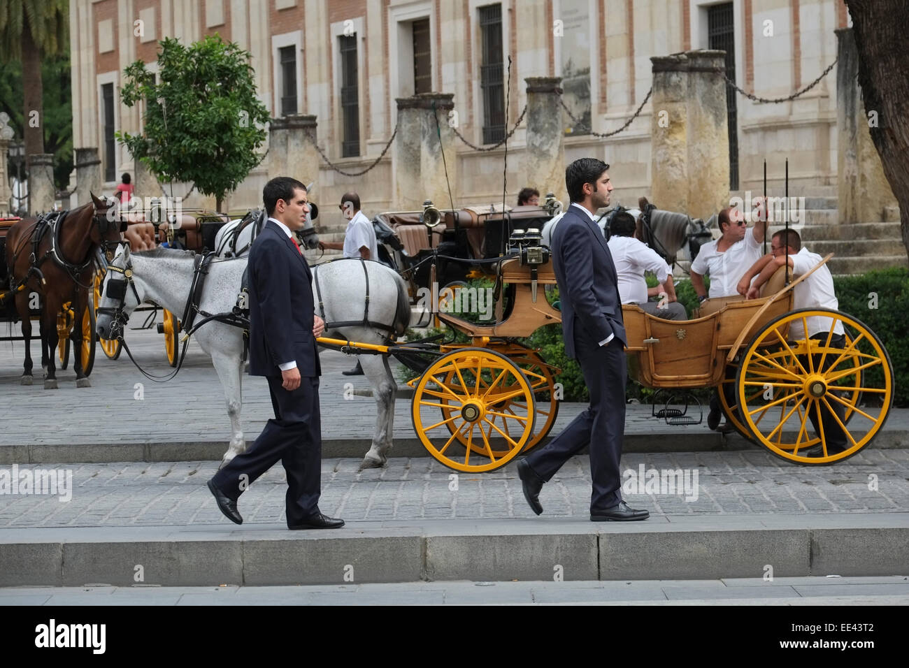 Seville, Spain: Smartly dressed men in Seville Street Stock Photo - Alamy