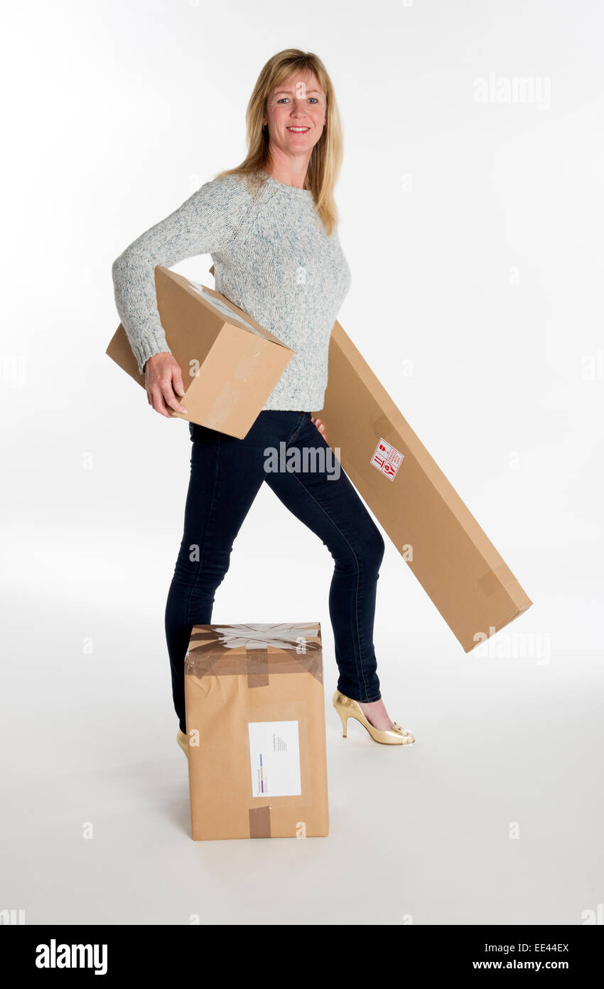 Woman carrying cardboard boxes Stock Photo - Alamy