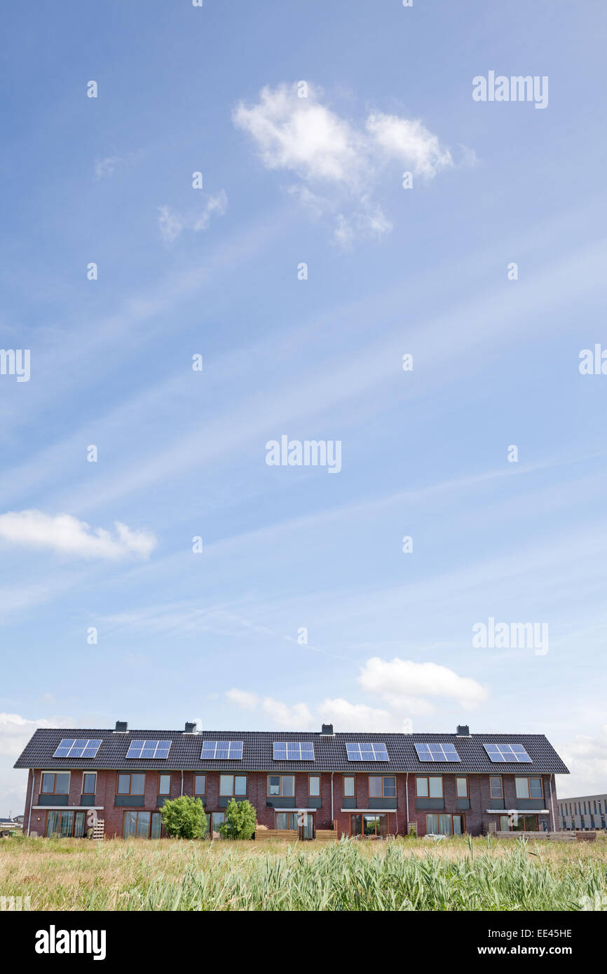 Family homes with solar panels Stock Photo - Alamy