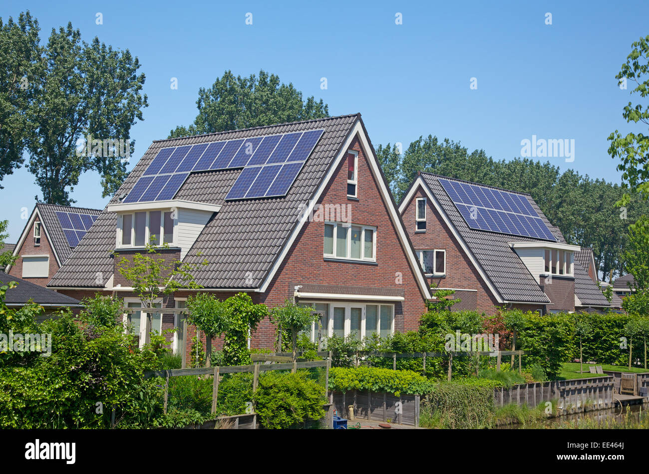 Family homes with solar panels Stock Photo - Alamy