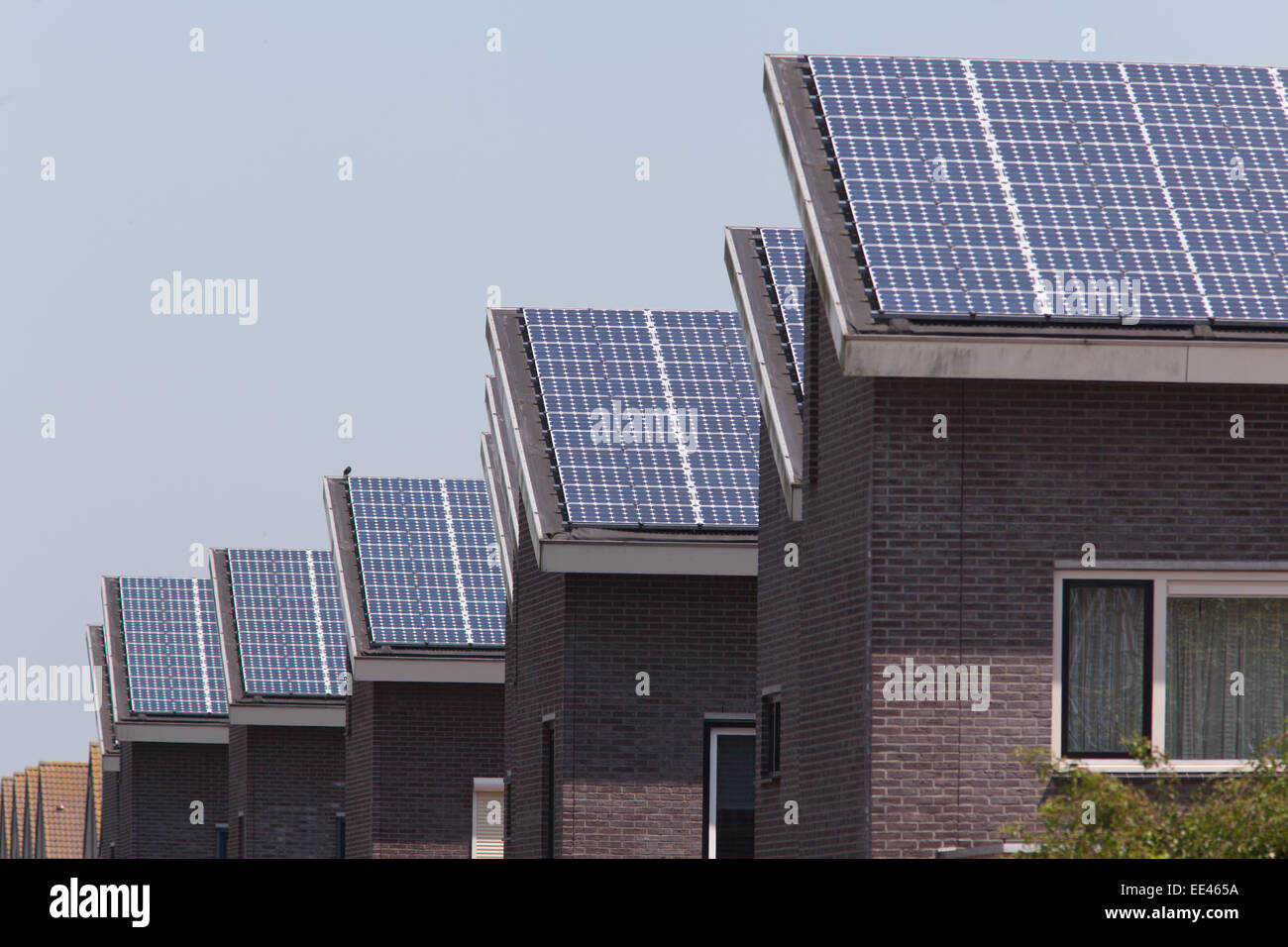 Family homes with solar panels Stock Photo - Alamy