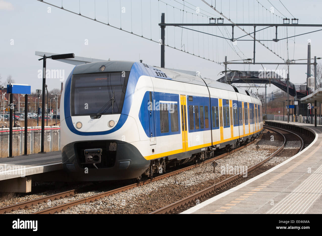 Train stopping in trainstation in The Netherlands Stock Photo - Alamy