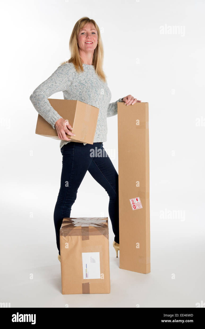 Woman carrying cardboard boxes Stock Photo - Alamy
