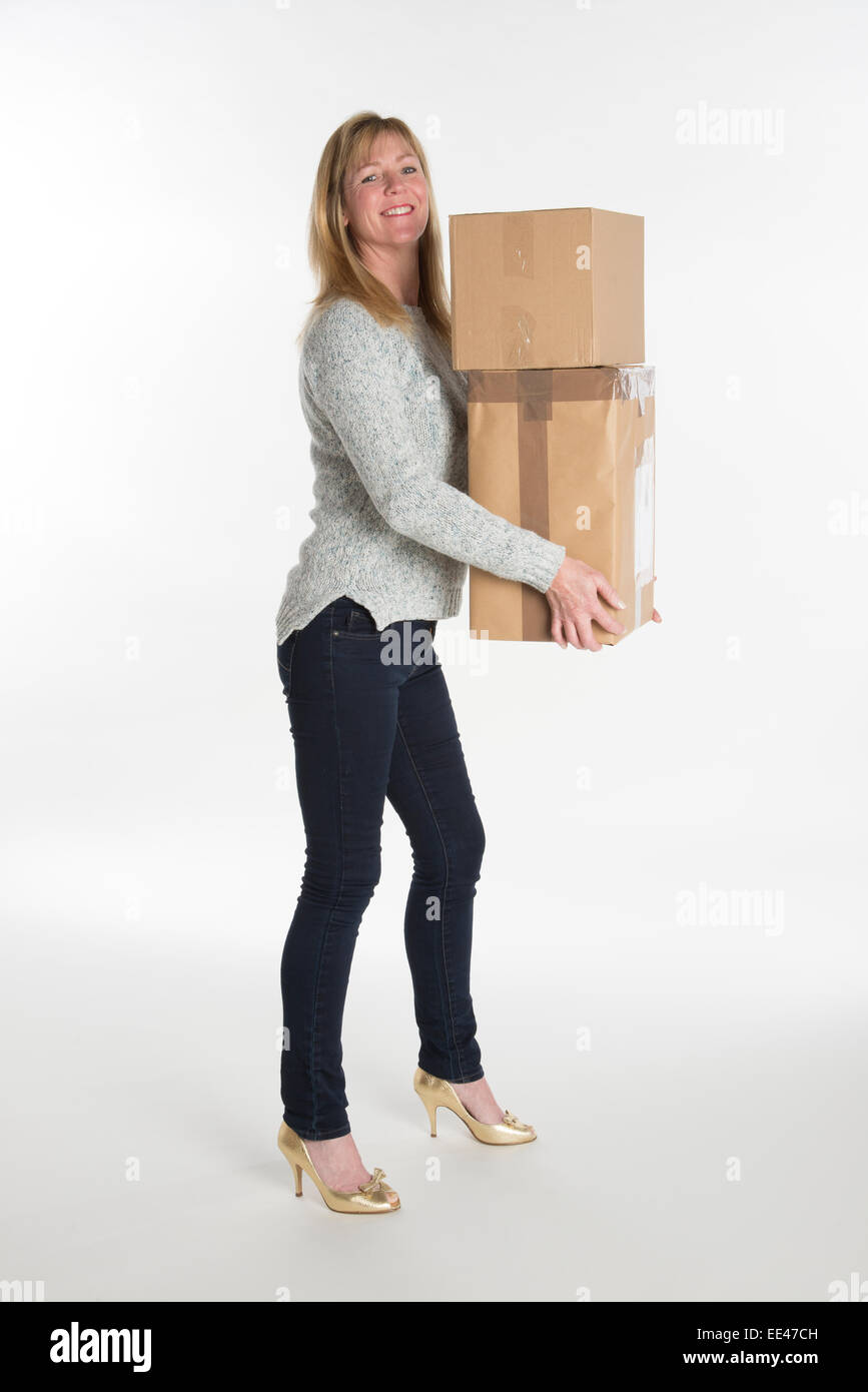 Woman holding paper boxes hi-res stock photography and images - Alamy