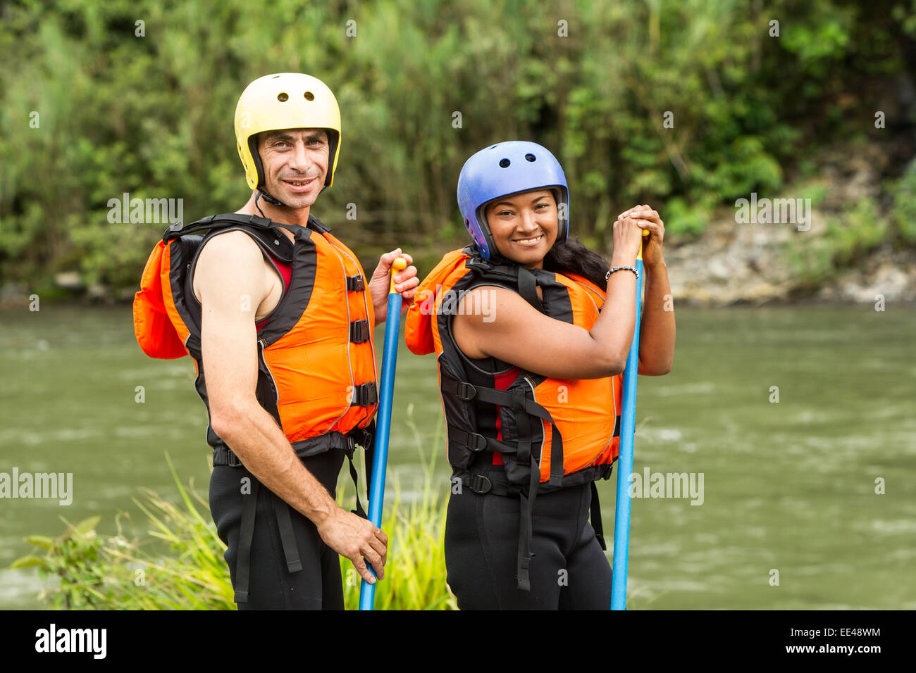 Adult Couple Prepared For White Water Rafting Trip Specific Equipment ...