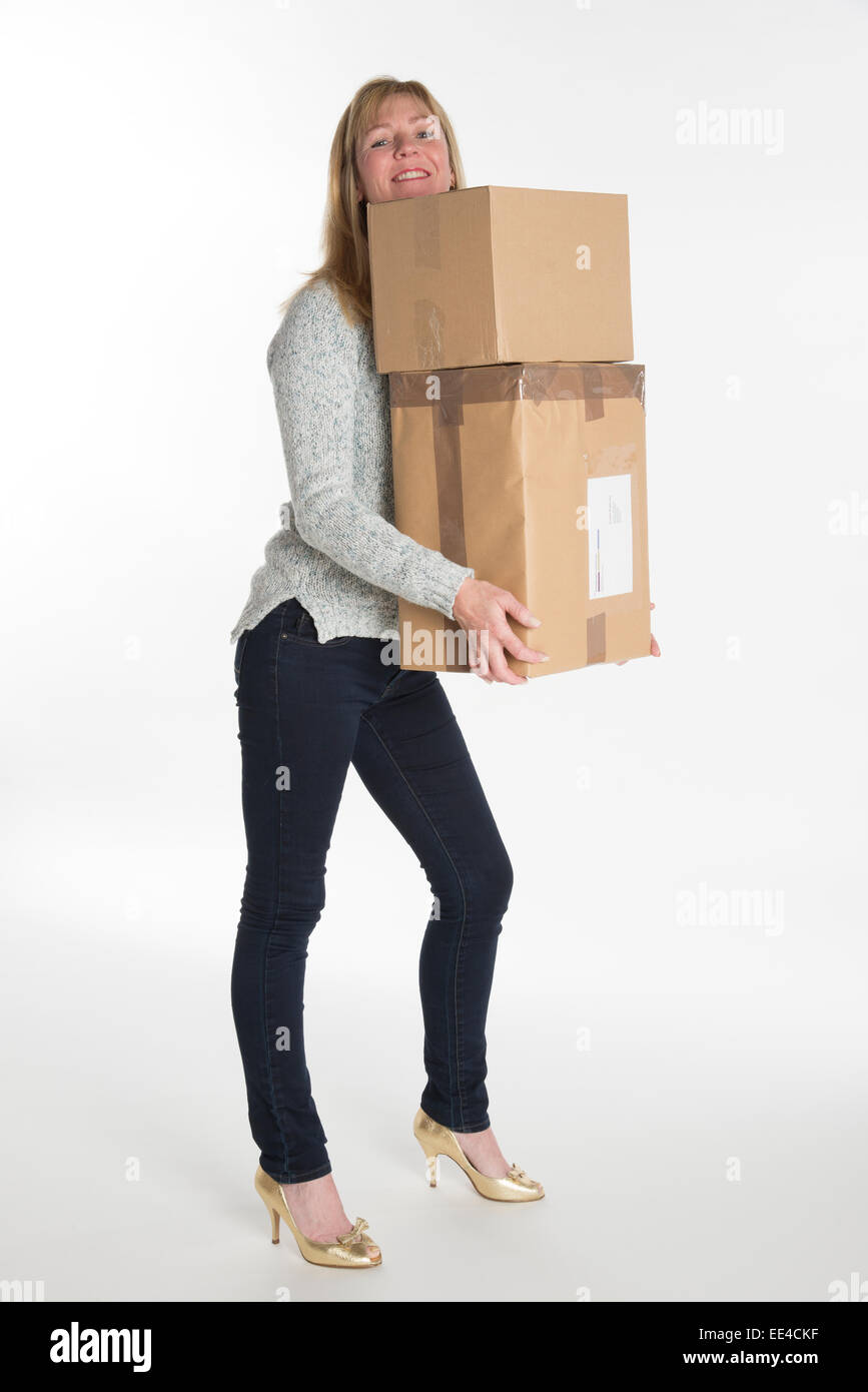 Woman carrying cardboard boxes Stock Photo - Alamy