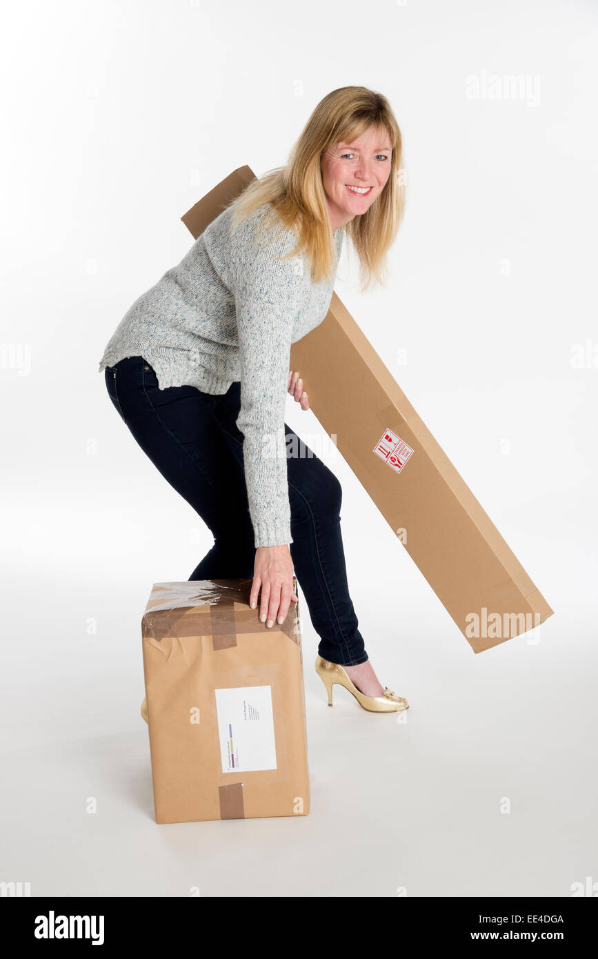 Woman carrying cardboard boxes Stock Photo - Alamy