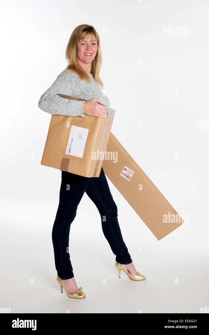 Woman carrying cardboard boxes Stock Photo - Alamy