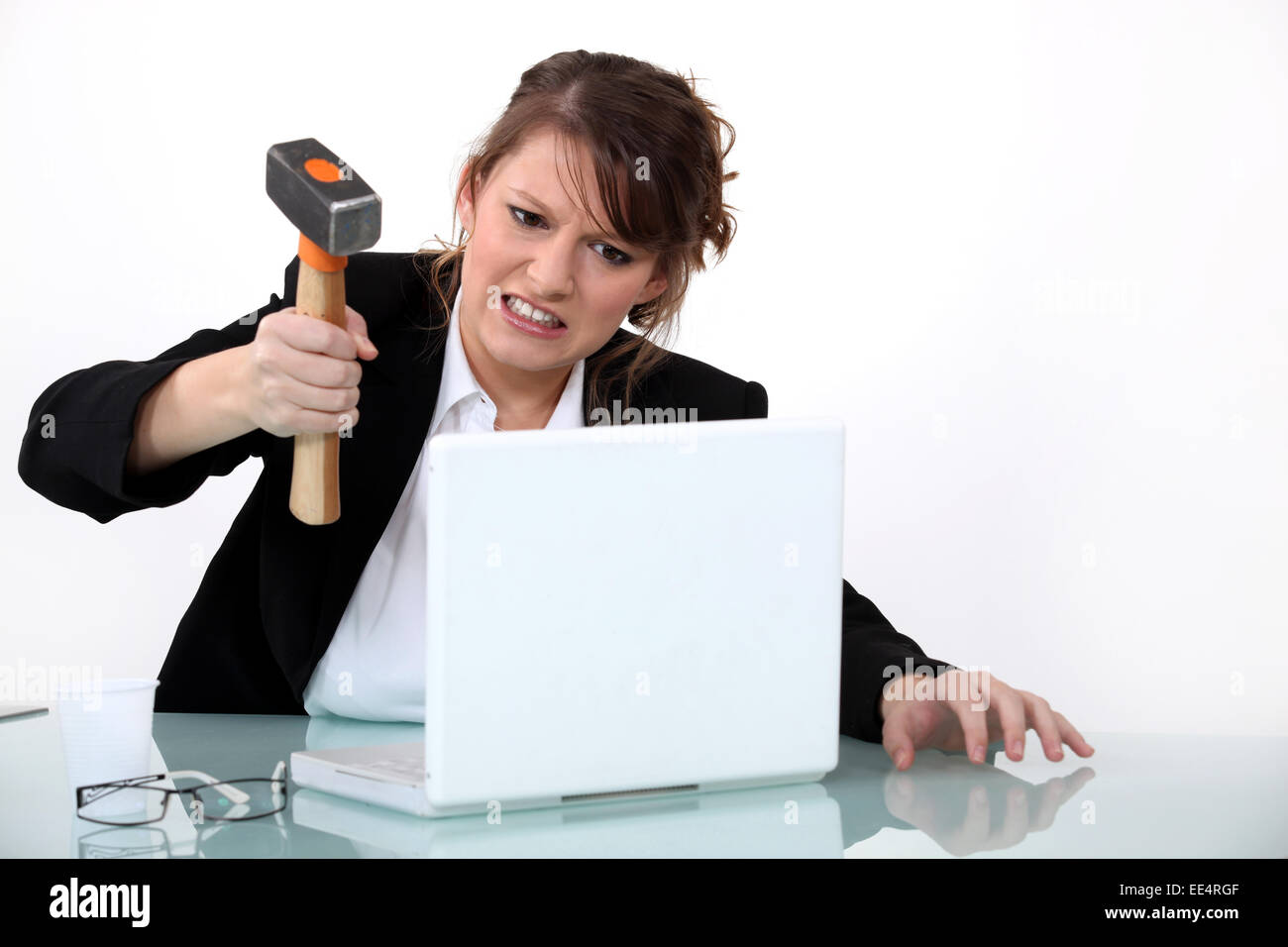 Woman smashing laptop hammer hi-res stock photography and images - Alamy