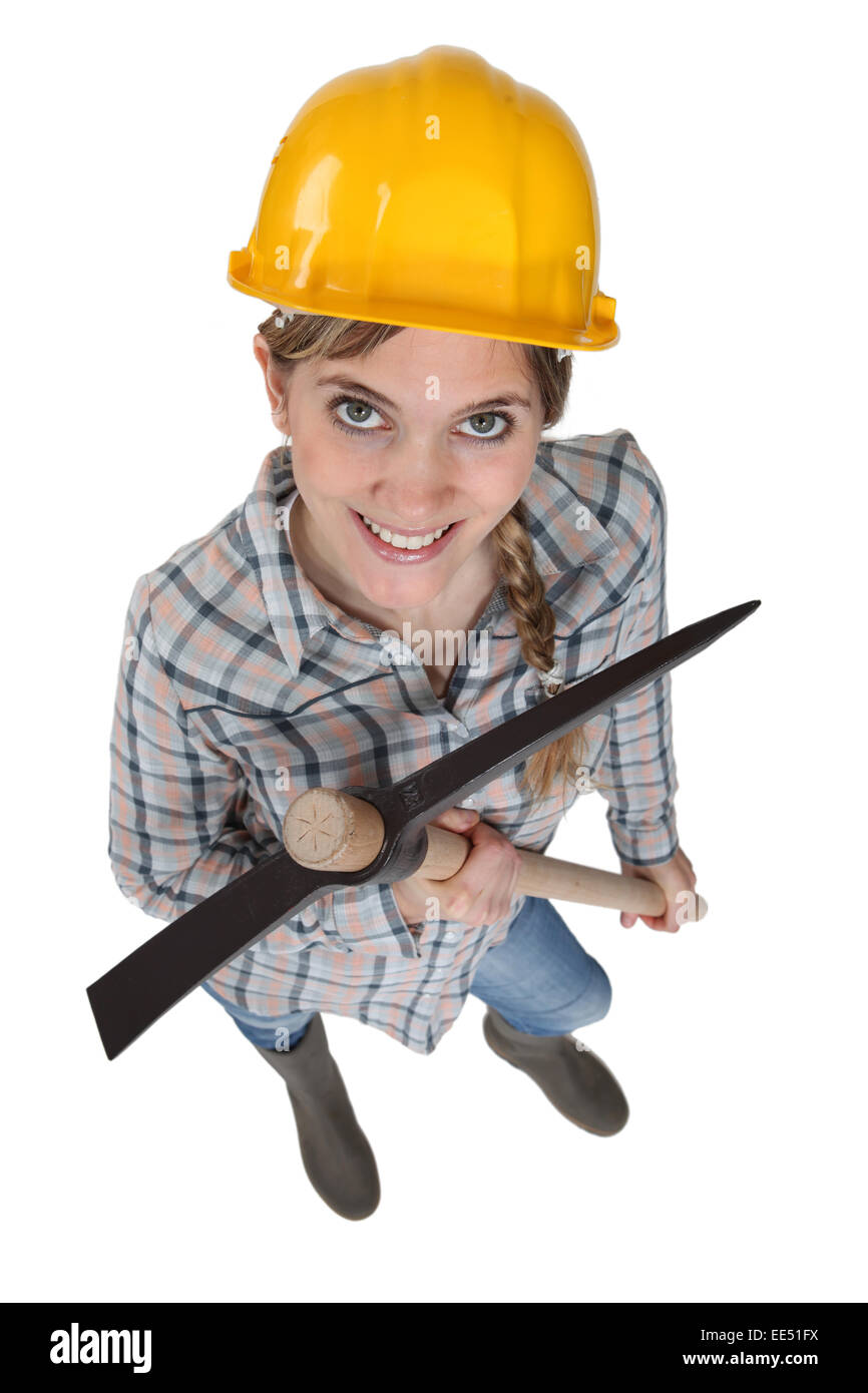 Female worker holding an pickaxe Stock Photo - Alamy
