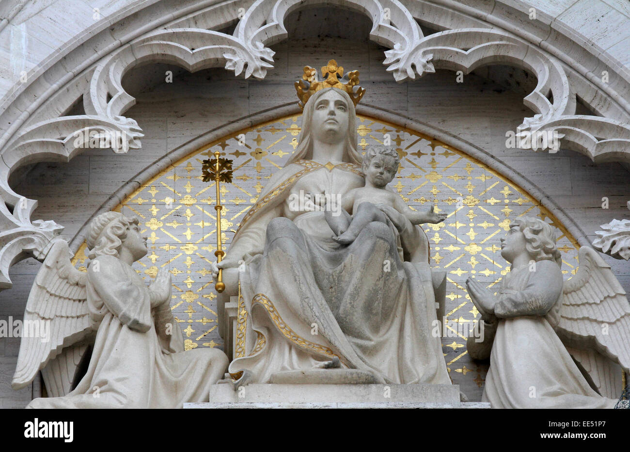 Madonna on the throne with the Child Jesus and two angels on the portal ...