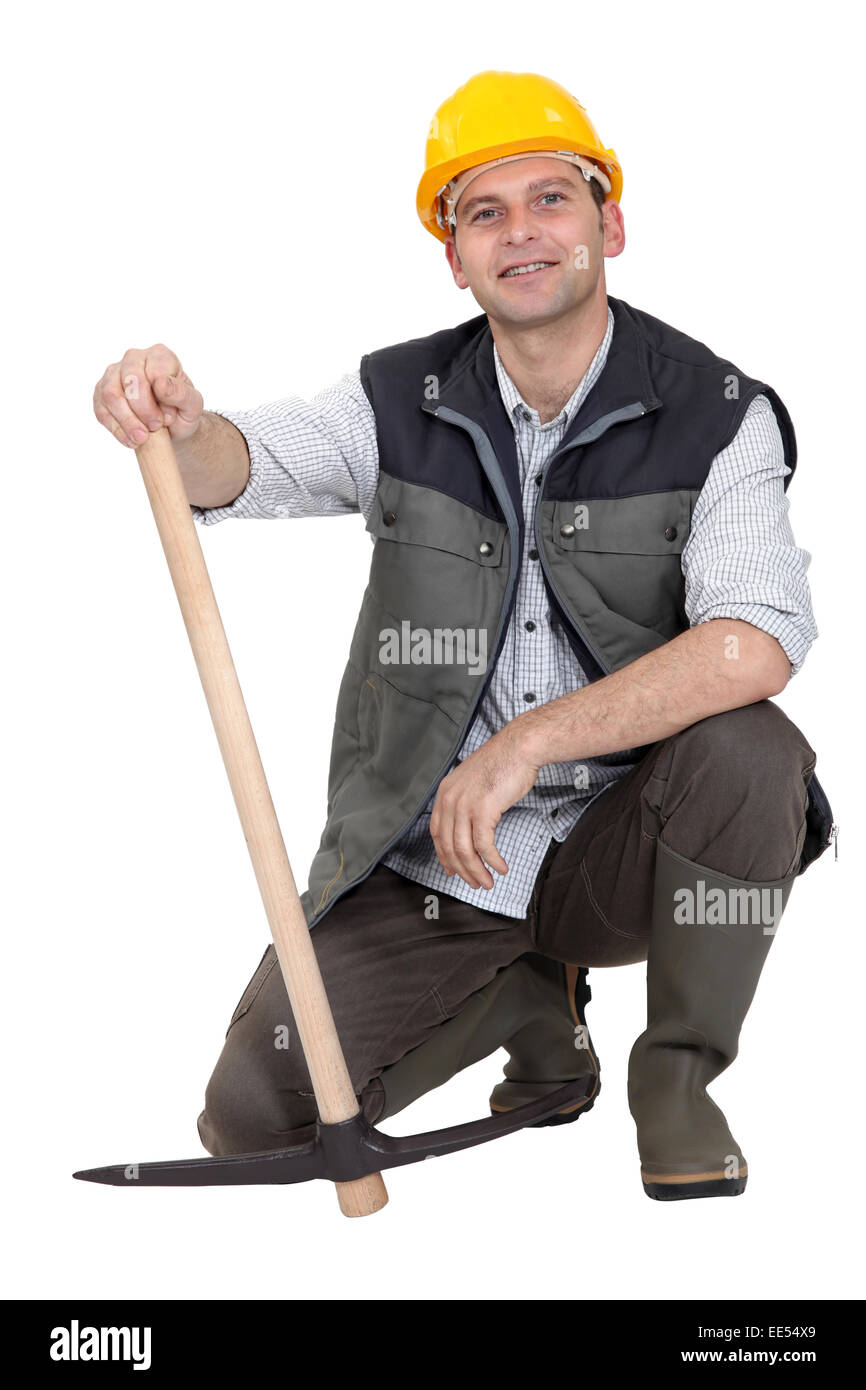 Construction worker with a pickaxe Stock Photo - Alamy