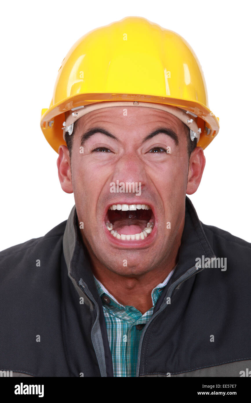 Construction worker screaming Stock Photo - Alamy