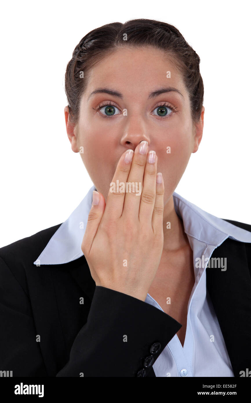 surprised woman putting hand on her mouth Stock Photo - Alamy