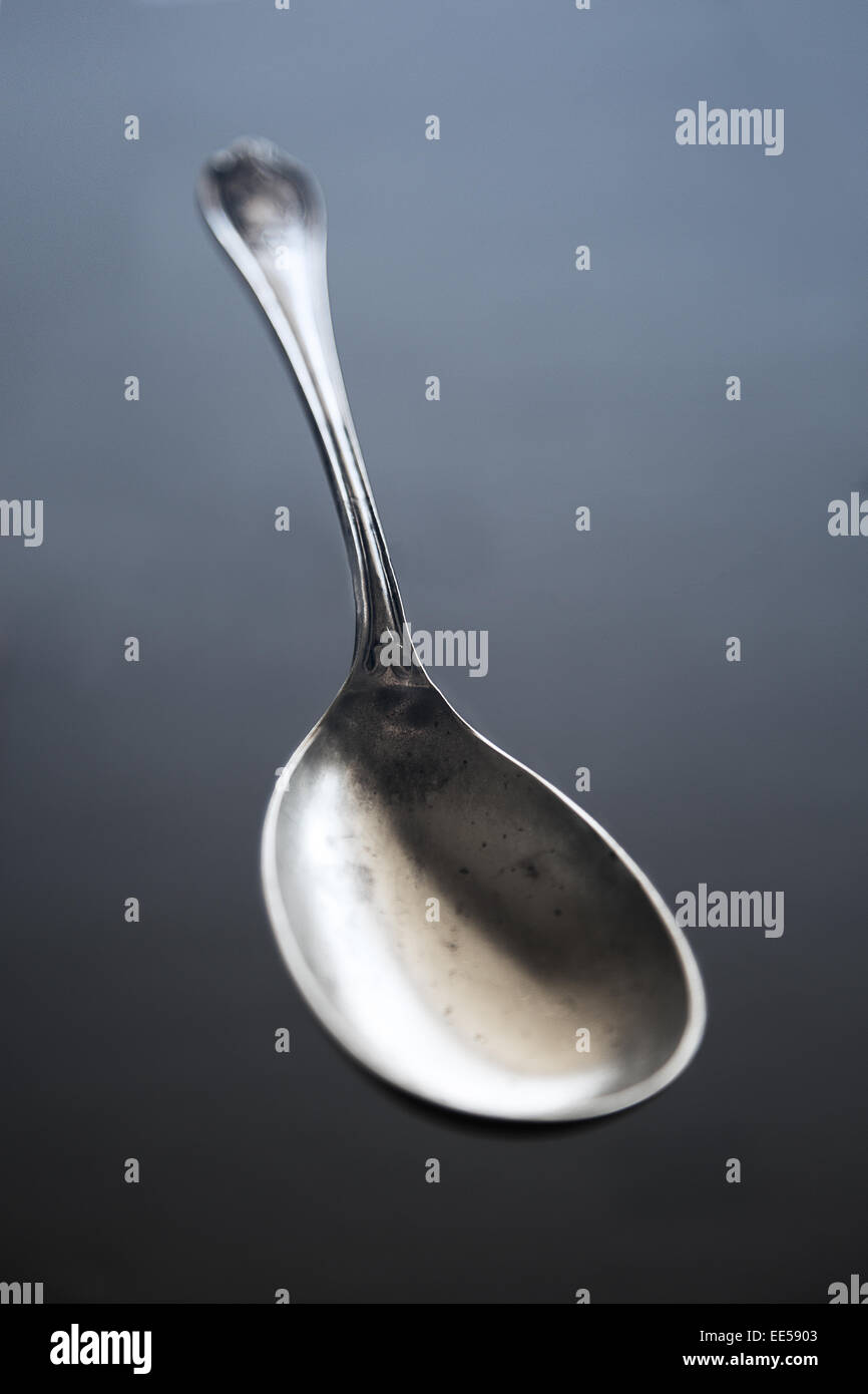 Floating Silver spoon Stock Photo - Alamy