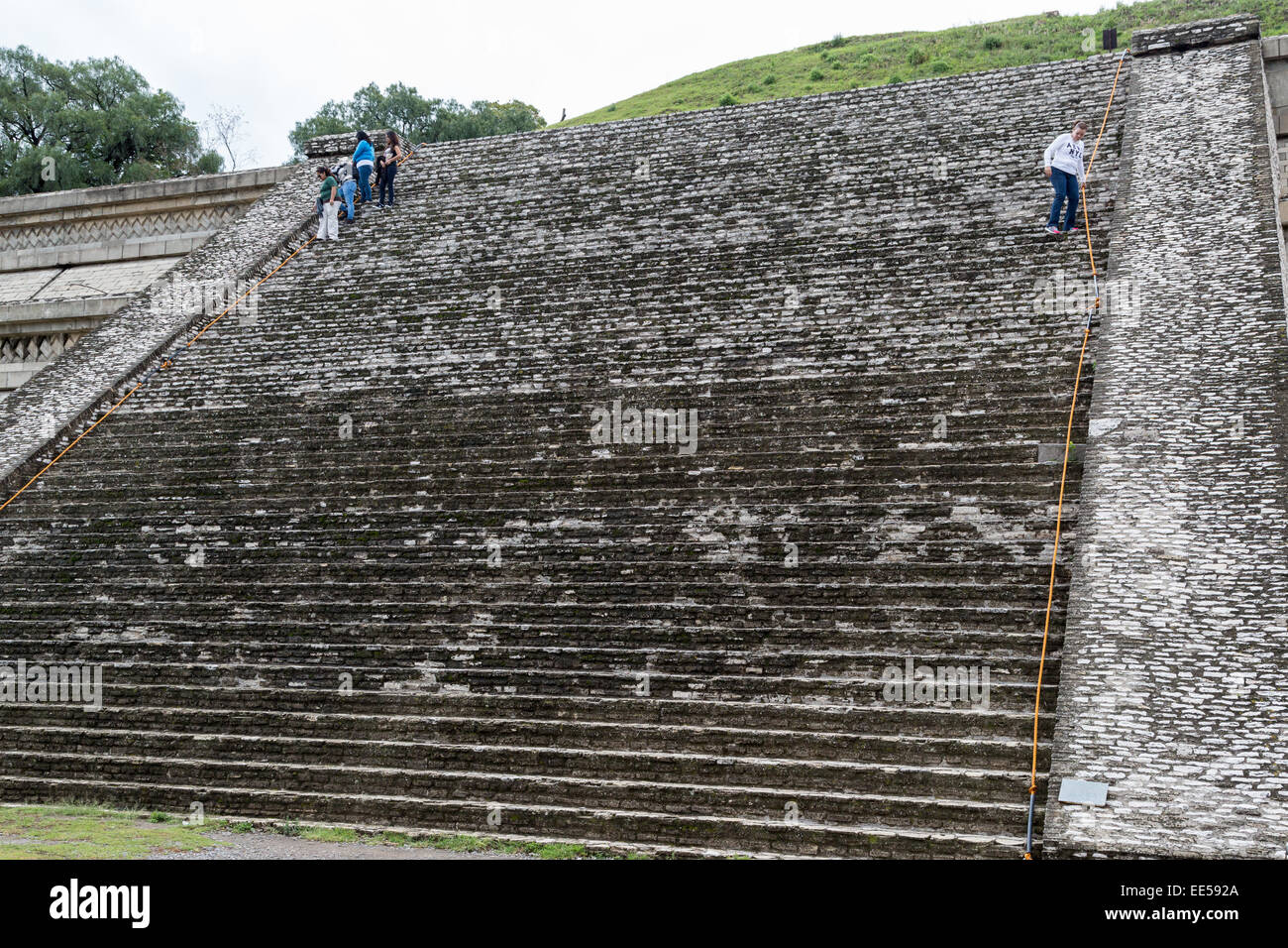 Tourists climbing the reconstructed base at The Great Pyramid of ...