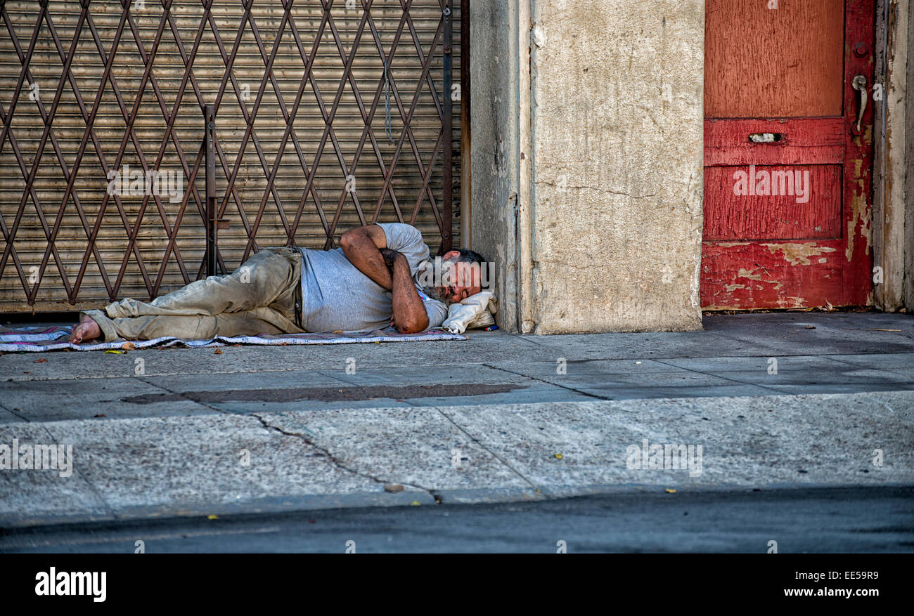 Man sleeping on the sidewalk High Resolution Stock Photography and ...