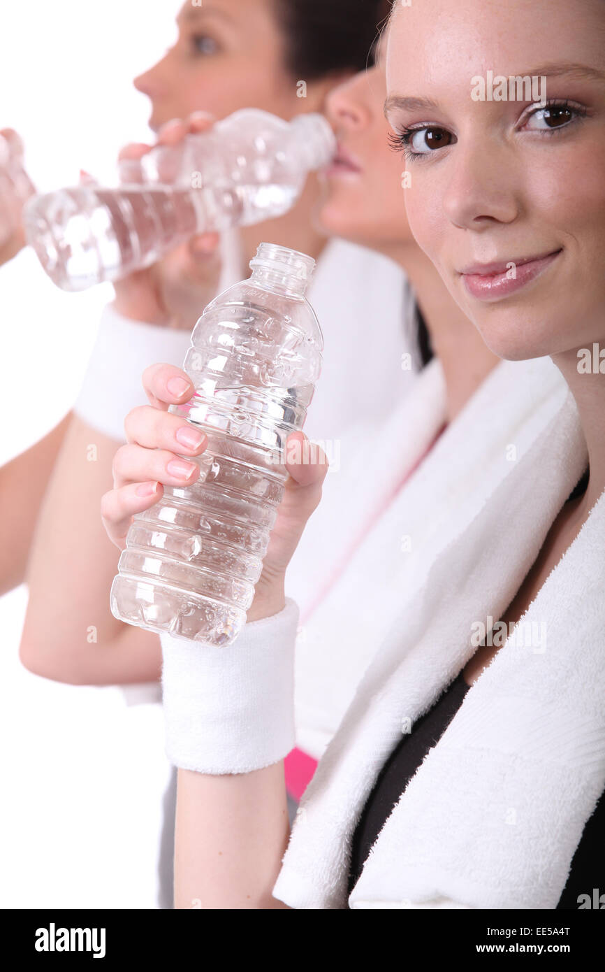 women drinking water after training Stock Photo - Alamy
