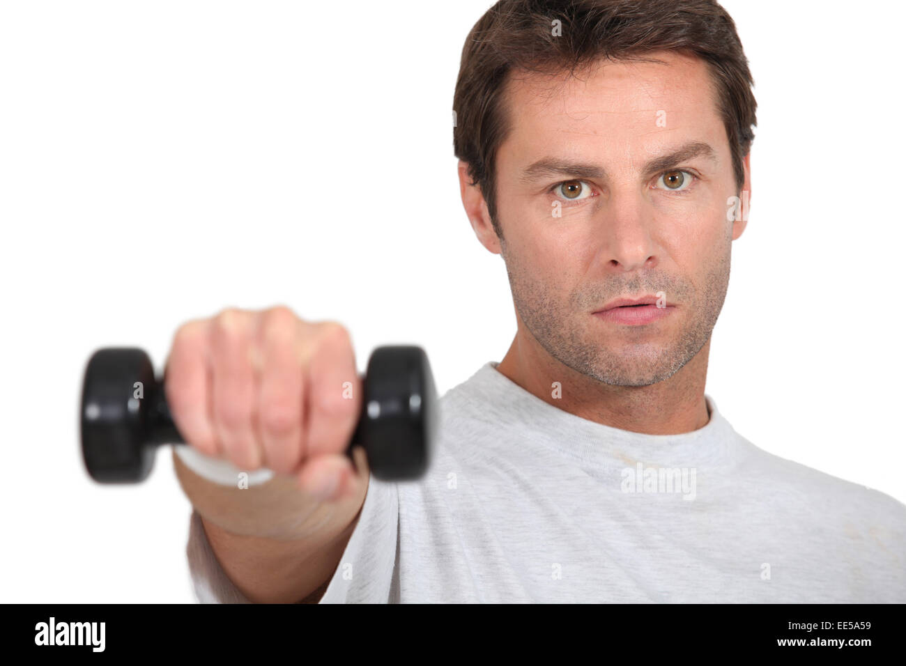 Man lifting weights Stock Photo - Alamy