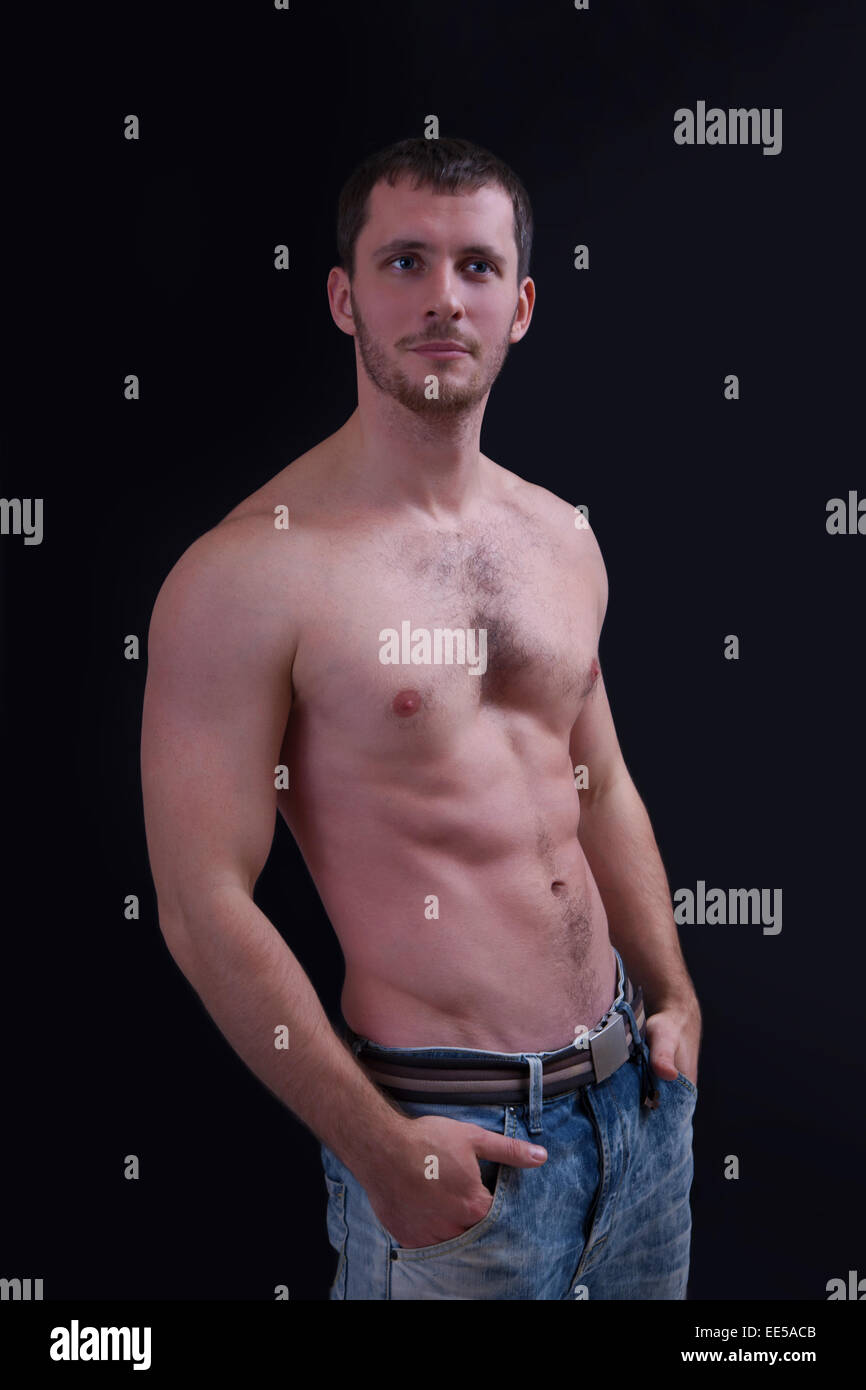 Portrait of shirtless handsome man, black background Stock Photo - Alamy