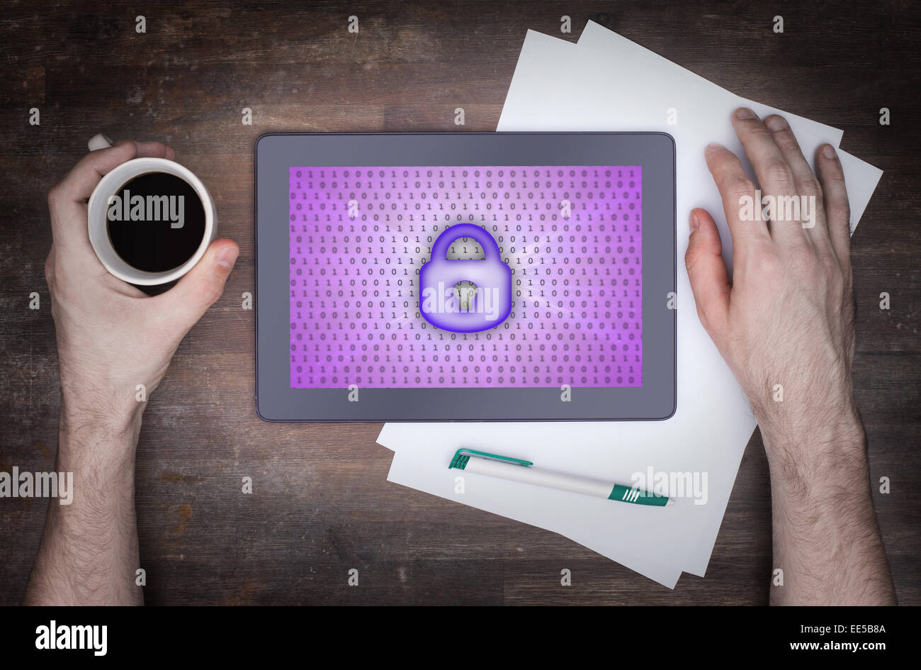 Tablet on a desk, concept of data protection, purple Stock Photo - Alamy
