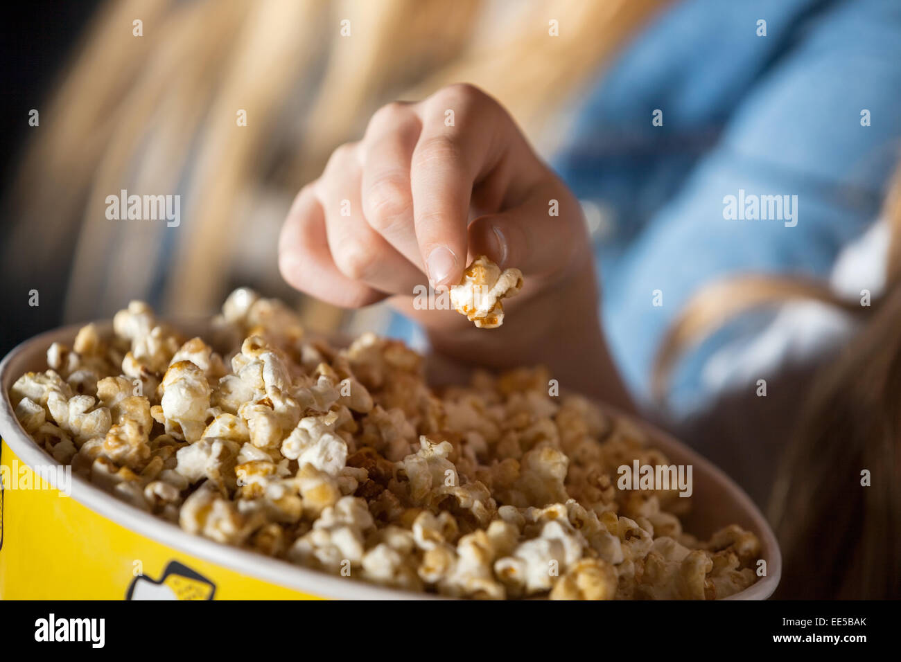 Girl Eating Popcorn In Cinema Theater Stock Photo - Alamy