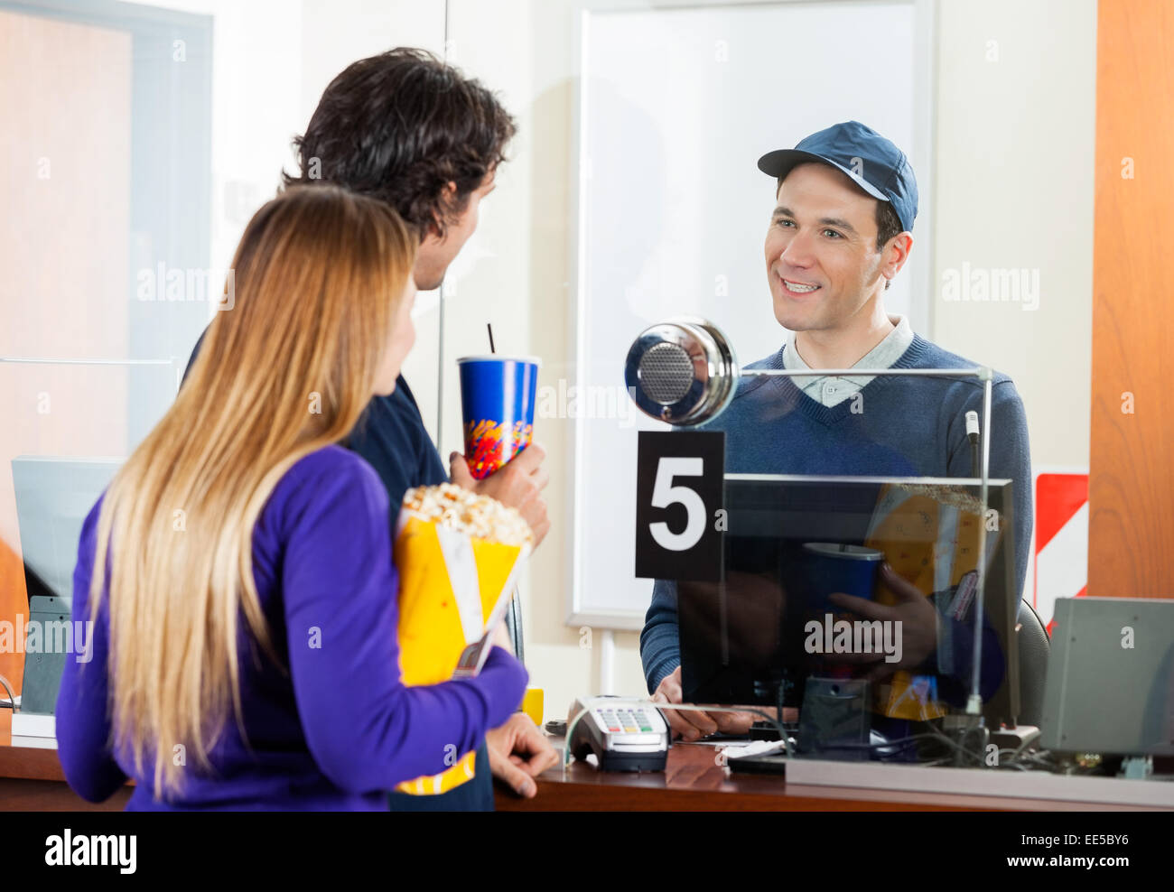 Couple buying movie tickets box hi-res stock photography and images - Alamy
