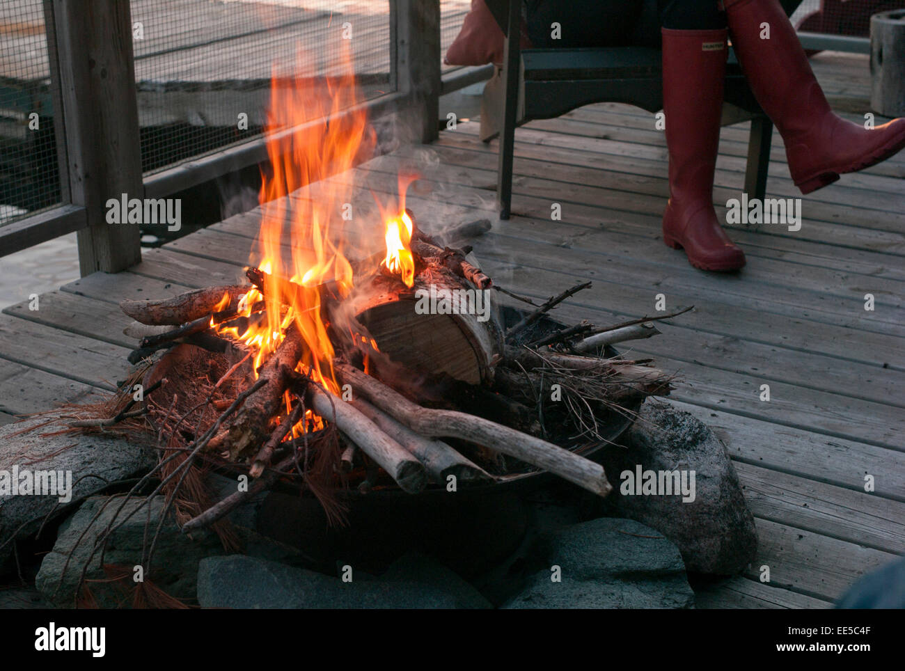 Campfire on dock, Lake of The Woods, Ontario, Canada Stock Photo - Alamy
