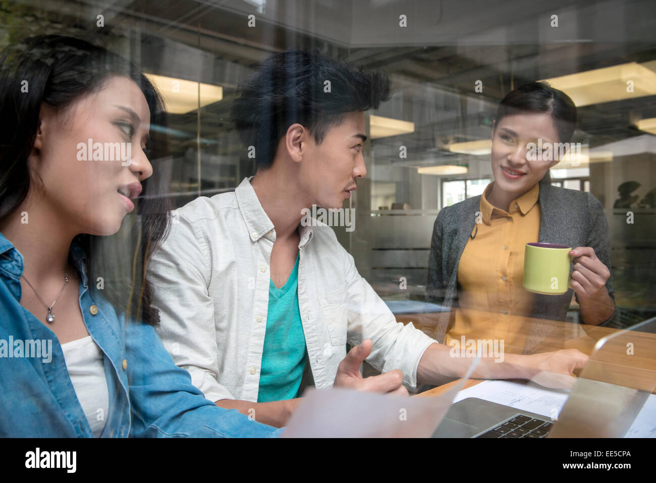 Creatives having informal meeting Stock Photo - Alamy