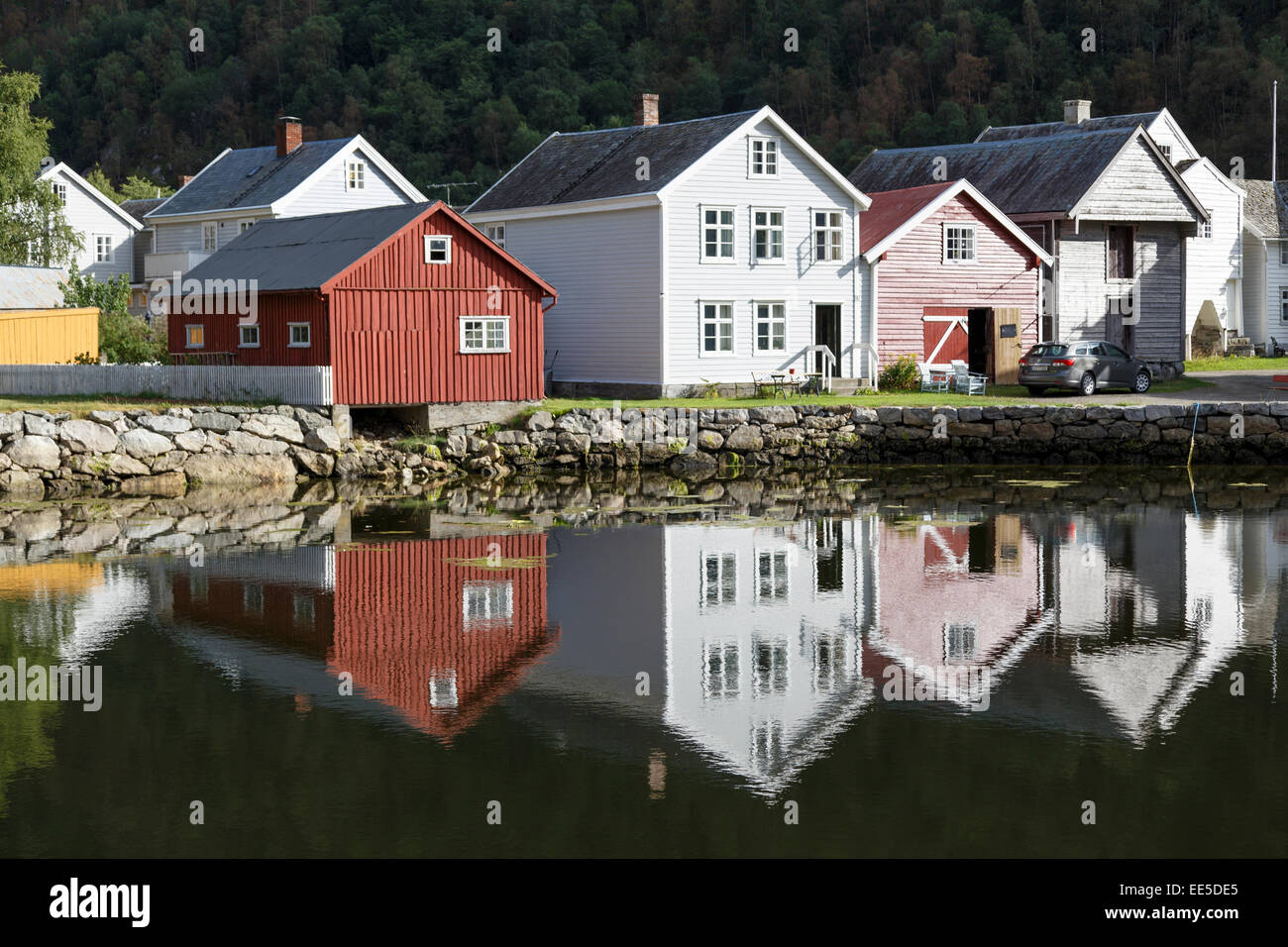 Traditional wooden Norwegian buildings on shores of Sognefjorden in ...