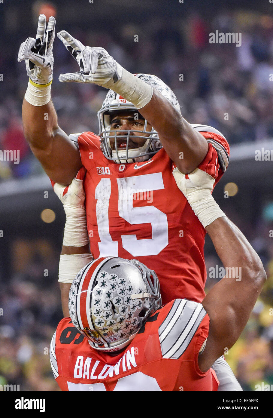 Ohio State Buckeyes running back Ezekiel Elliott (15)is lifted up into ...