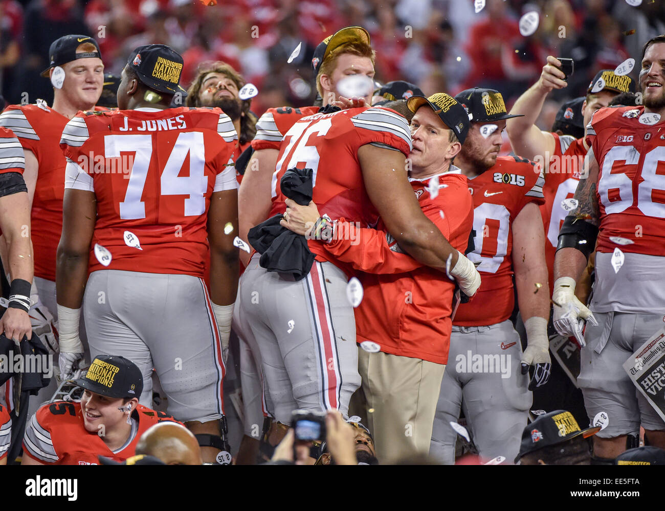 Ohio State Buckeyes offensive lineman Darryl Baldwin (76) hugs a coach ...