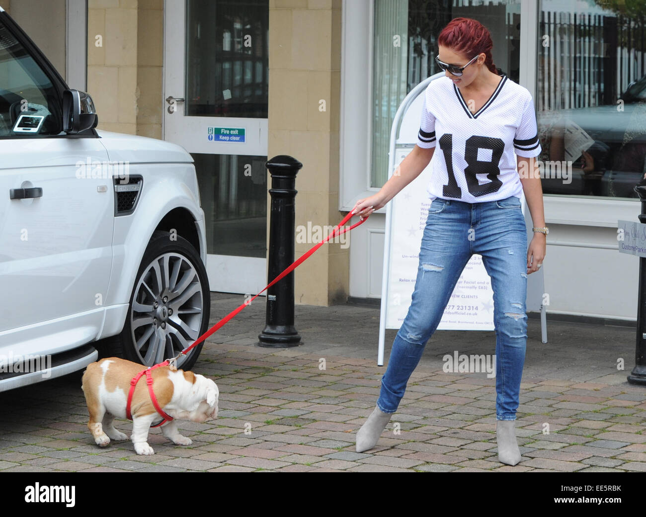 Amy Childs leaves her home in Brentwood, Essex carrying her new puppy ...