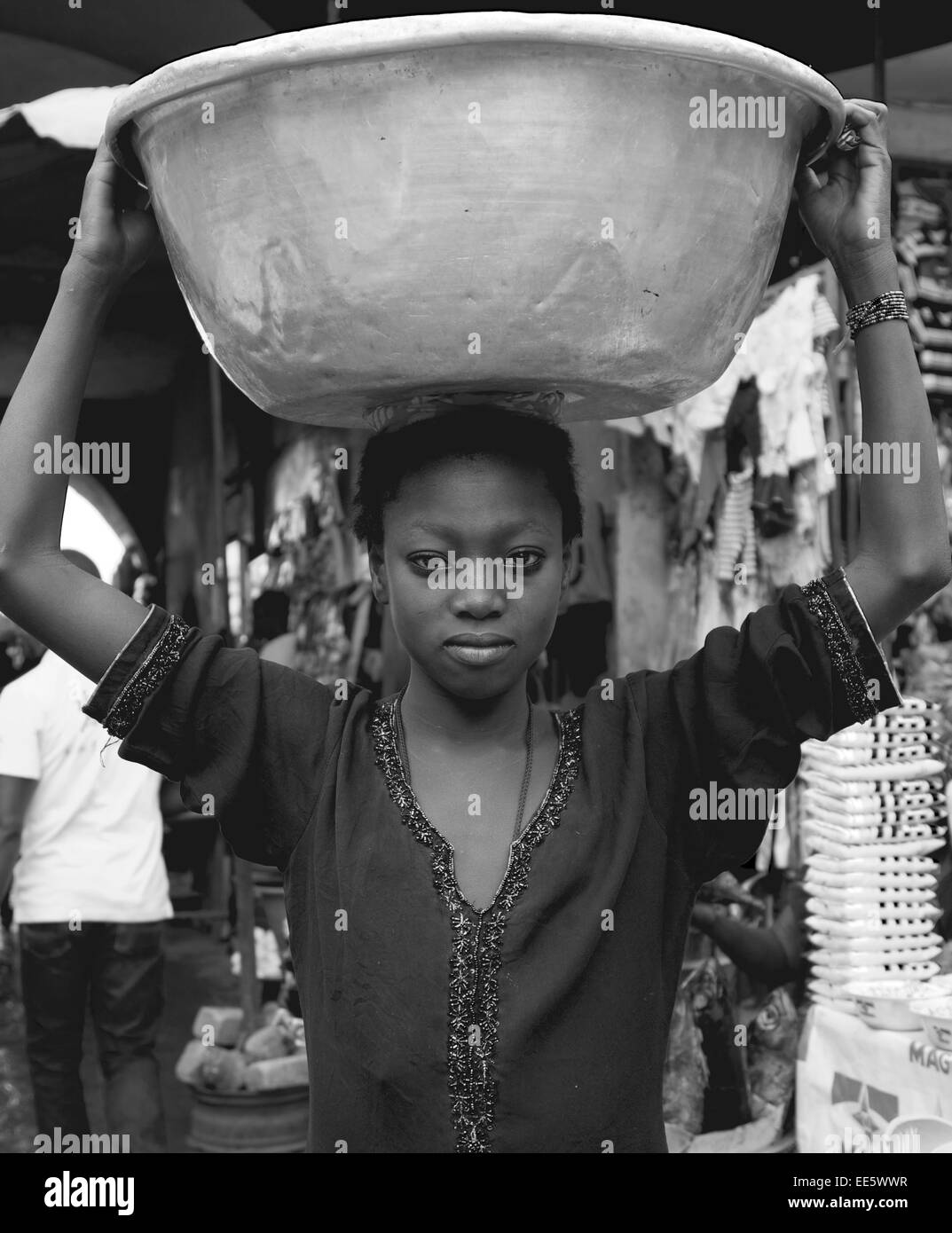Girl carrying food in Ghana Market. These girls helps shoppers carry ...