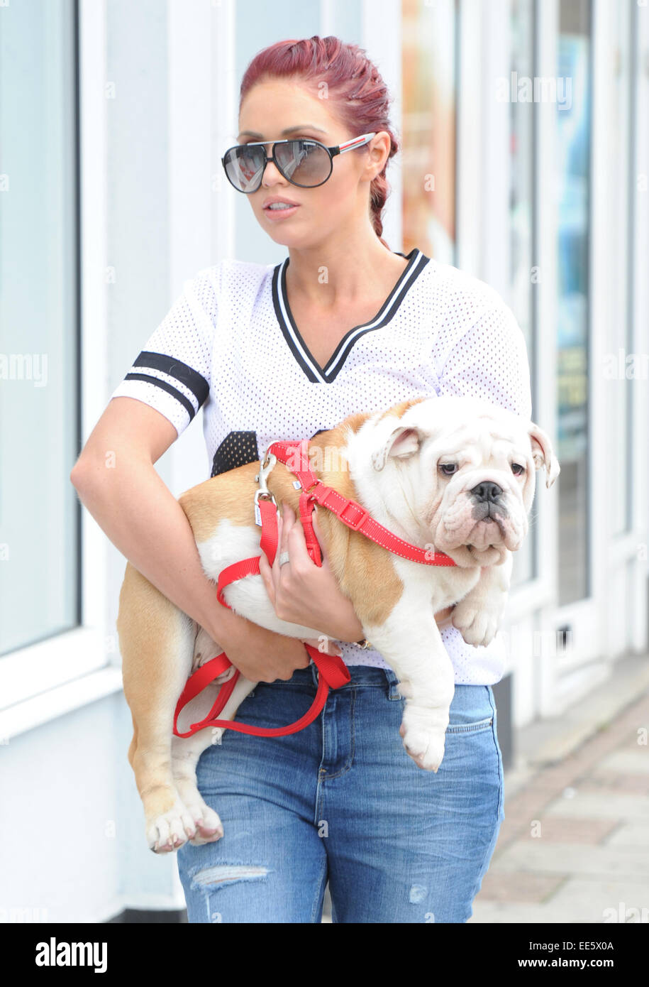 Amy Childs leaves her home in Brentwood, Essex carrying her new puppy ...