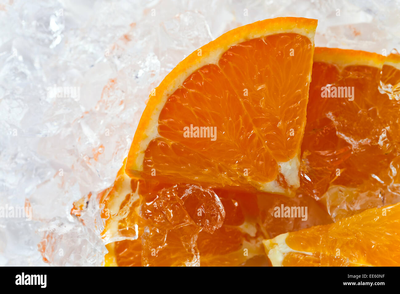 slices of orange with ice Stock Photo - Alamy