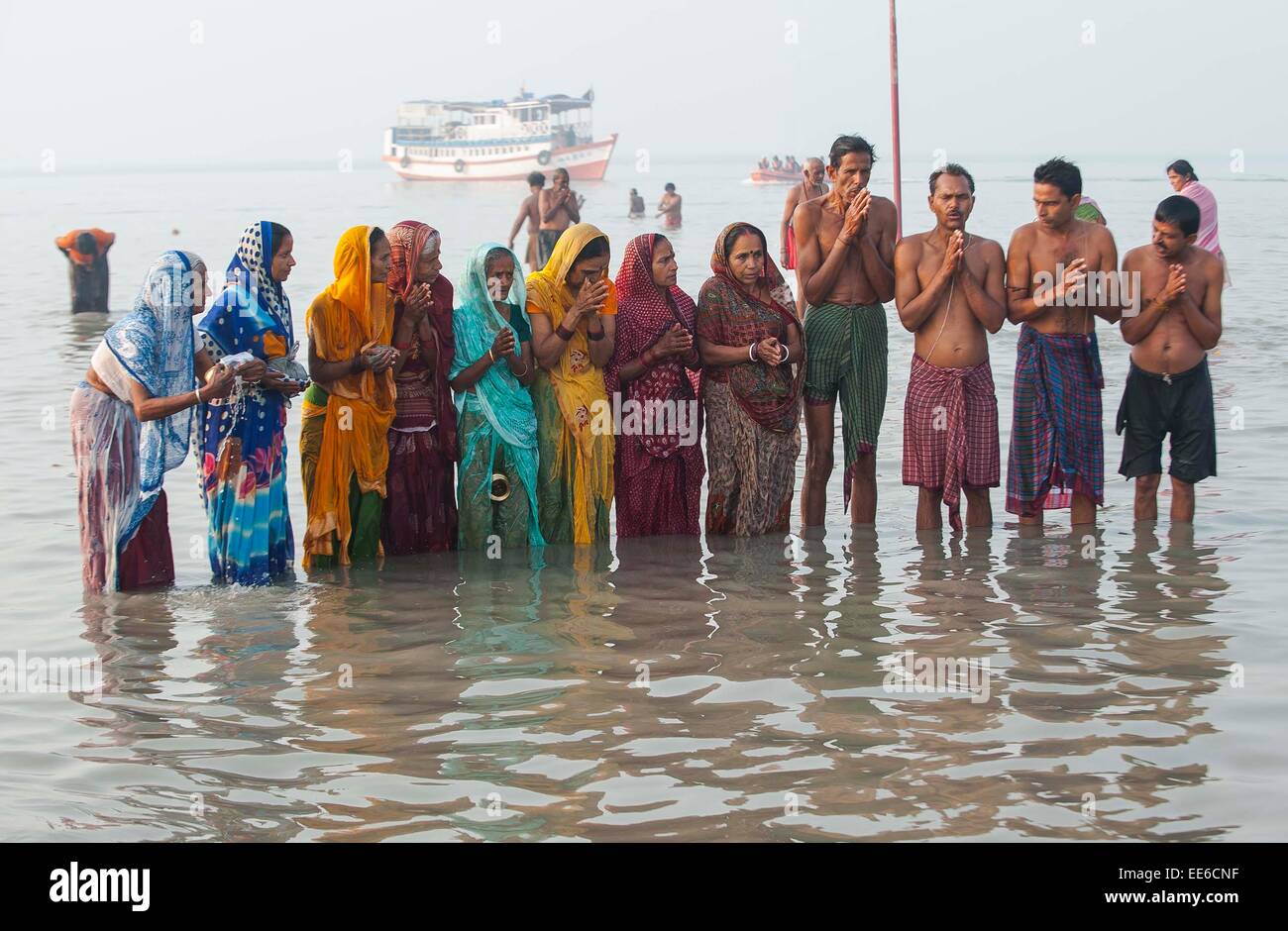 Hindu devotees take holy dip hi-res stock photography and images - Alamy