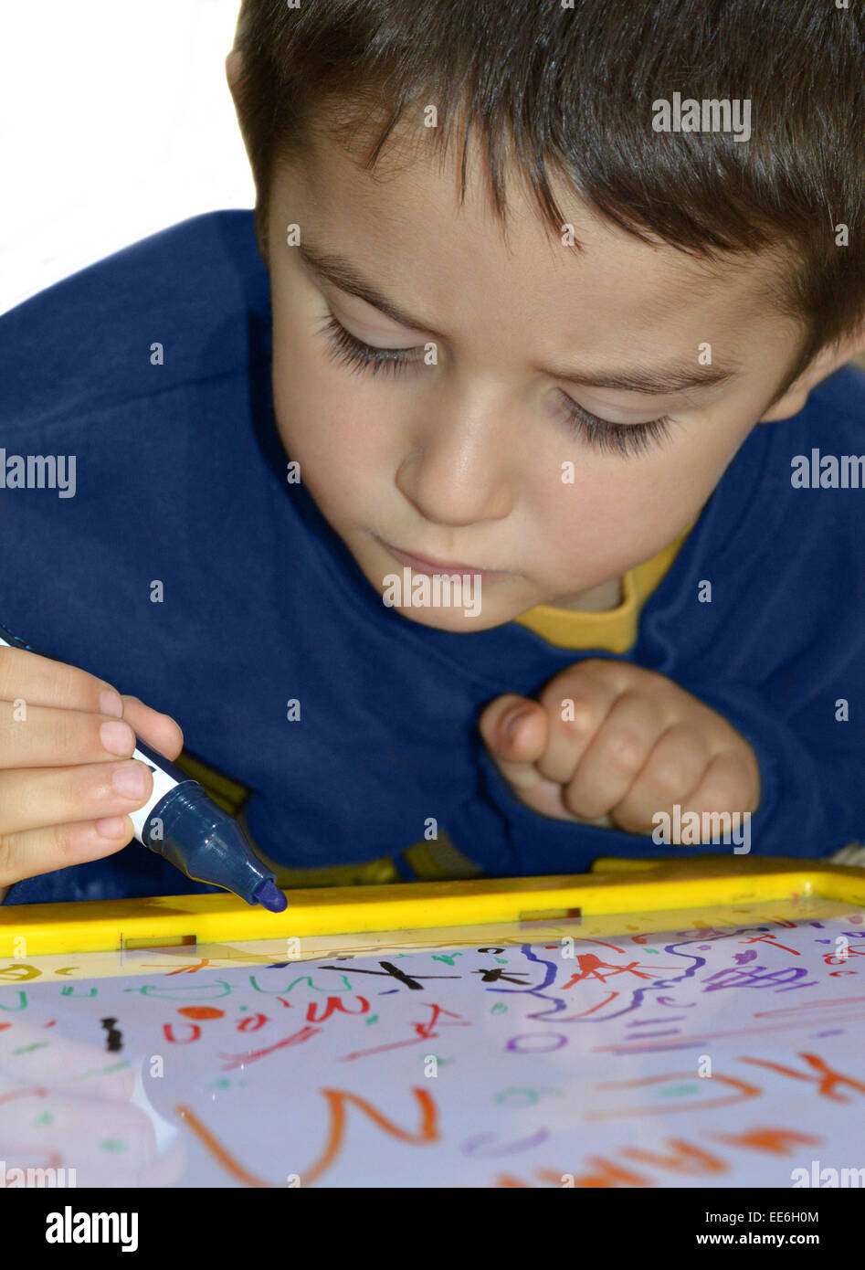 Little boy learning to write Stock Photo - Alamy