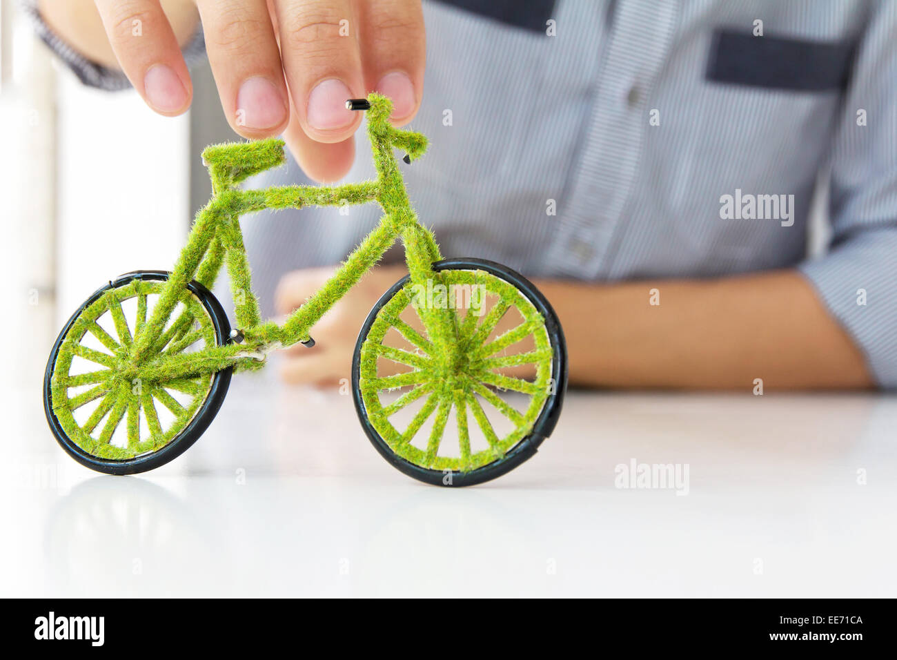 Hand Holding handcraft green bicycle Stock Photo - Alamy